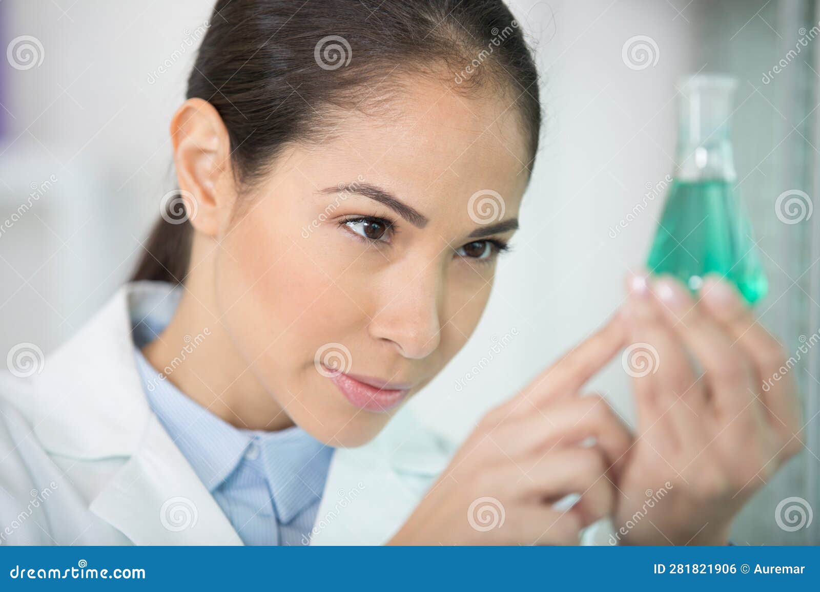 Female Scientist Examining Glass Flask Stock Photo - Image of female ...