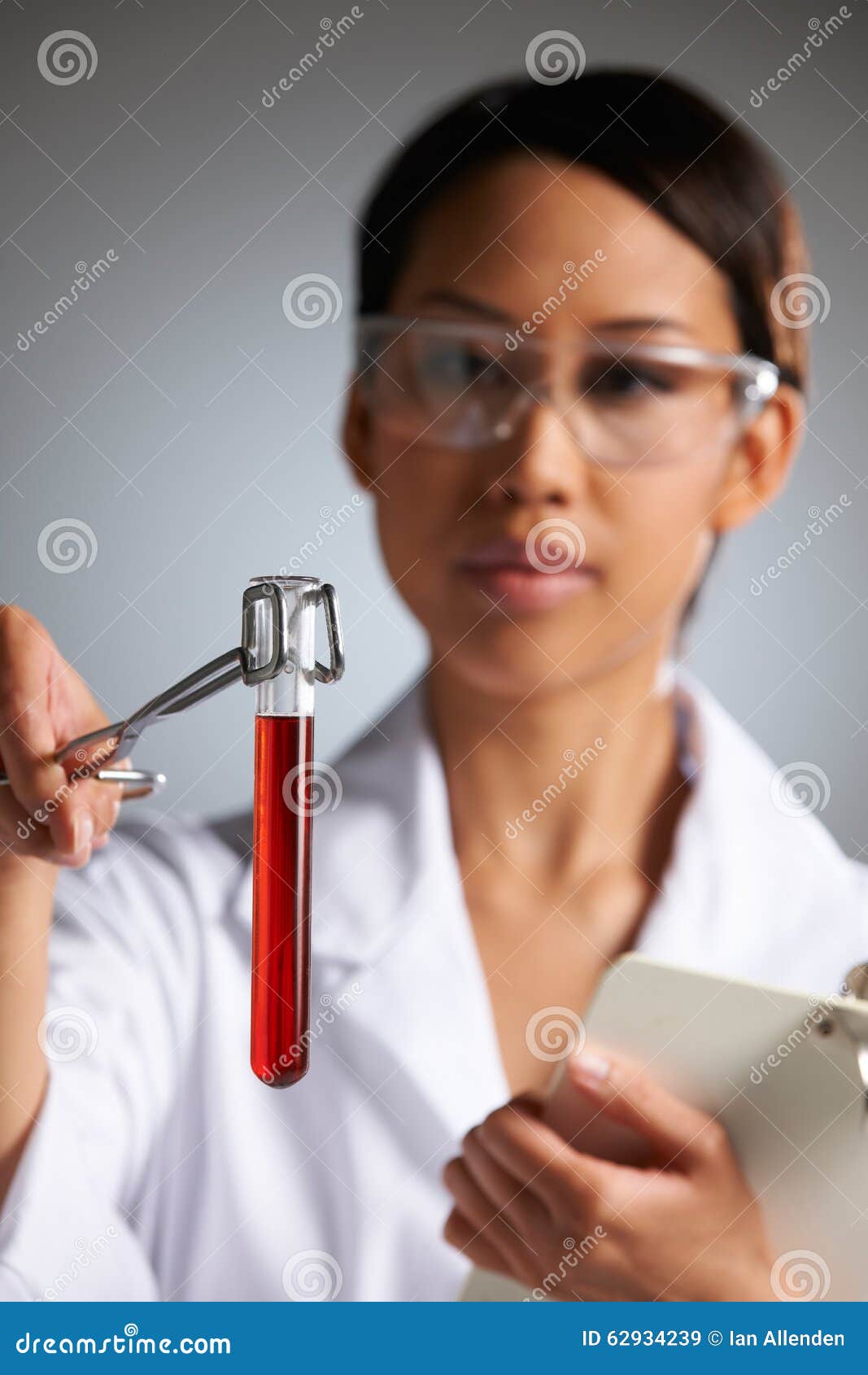 Female Scientist Examining Test Tube Stock Image - Image of copy, test ...