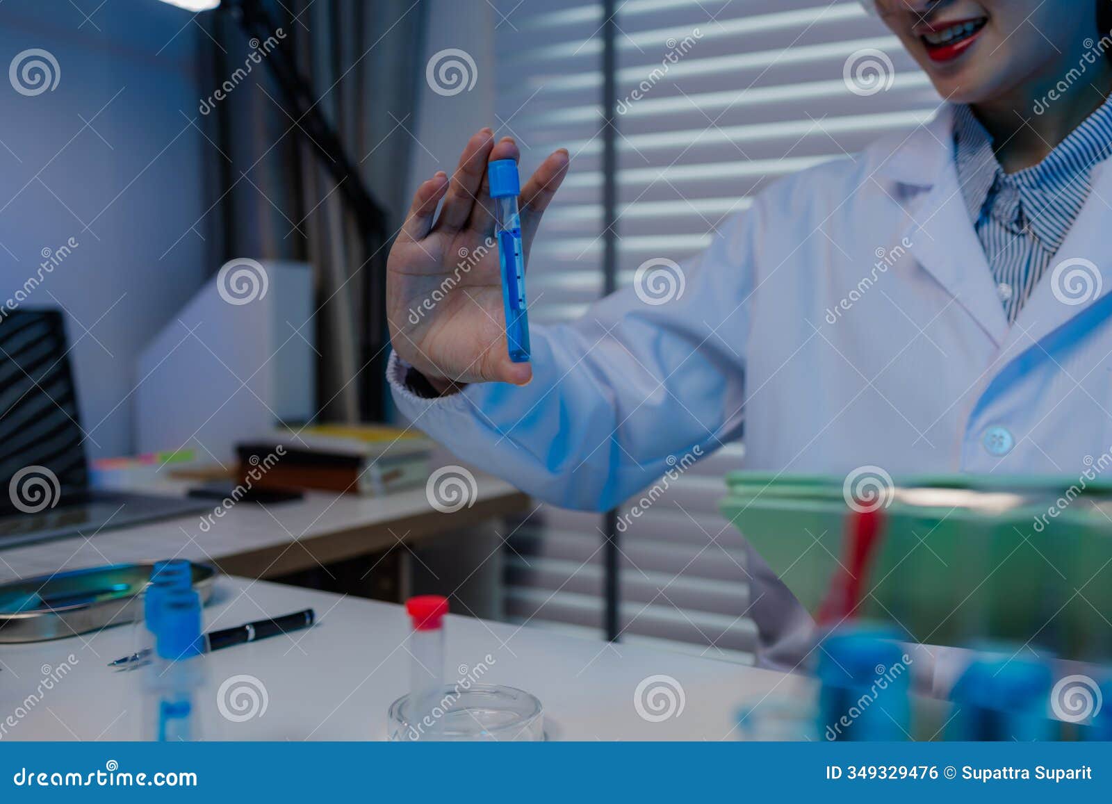 A Female Scientist is Experimenting with Chemicals in a Lab, Science ...