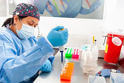 Female Scientist Extracting DNA Using the Spin Column-based Nucleic ...