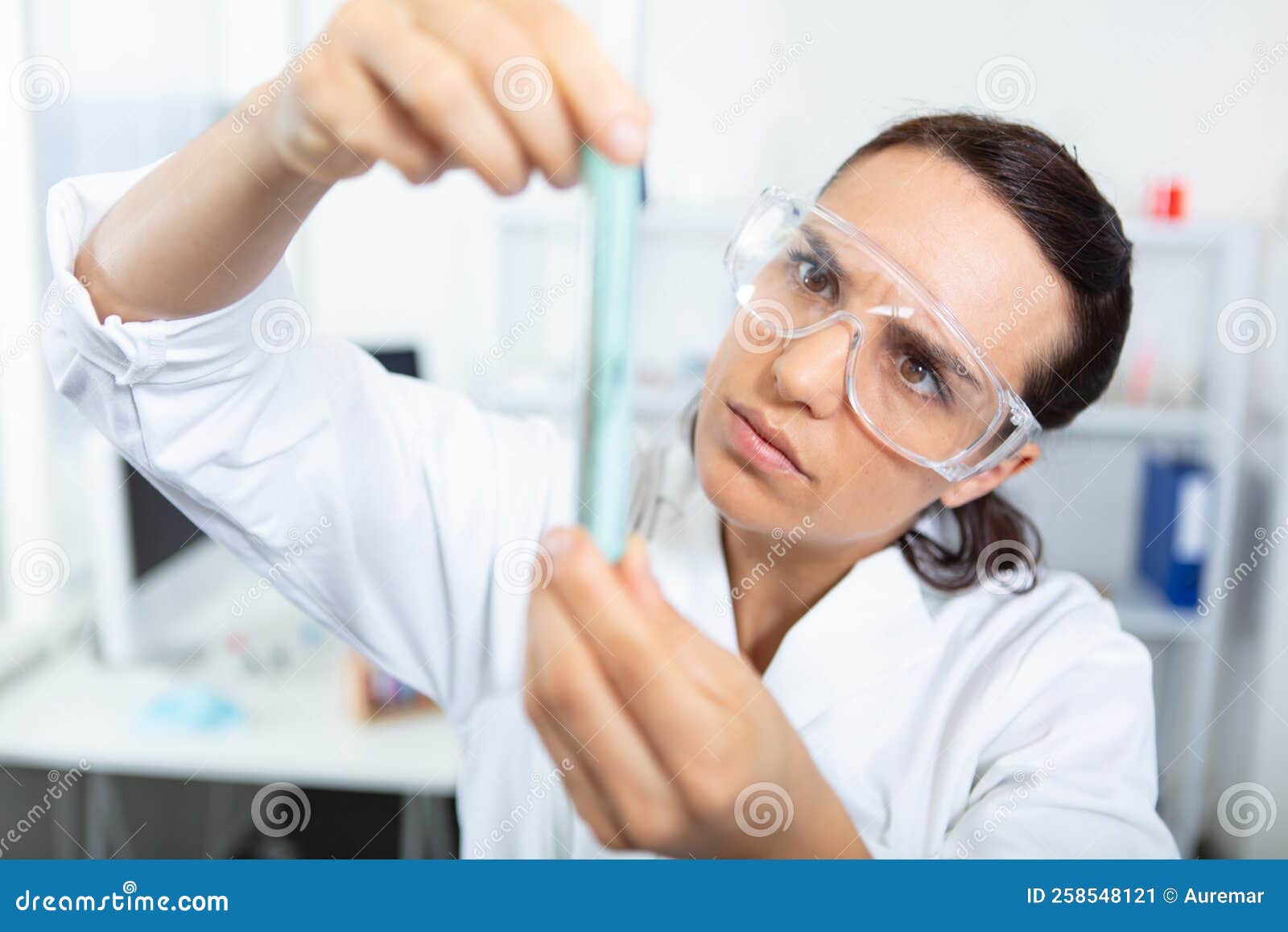 Female Scientist in Lab Examining Test-tube Stock Image - Image of ...