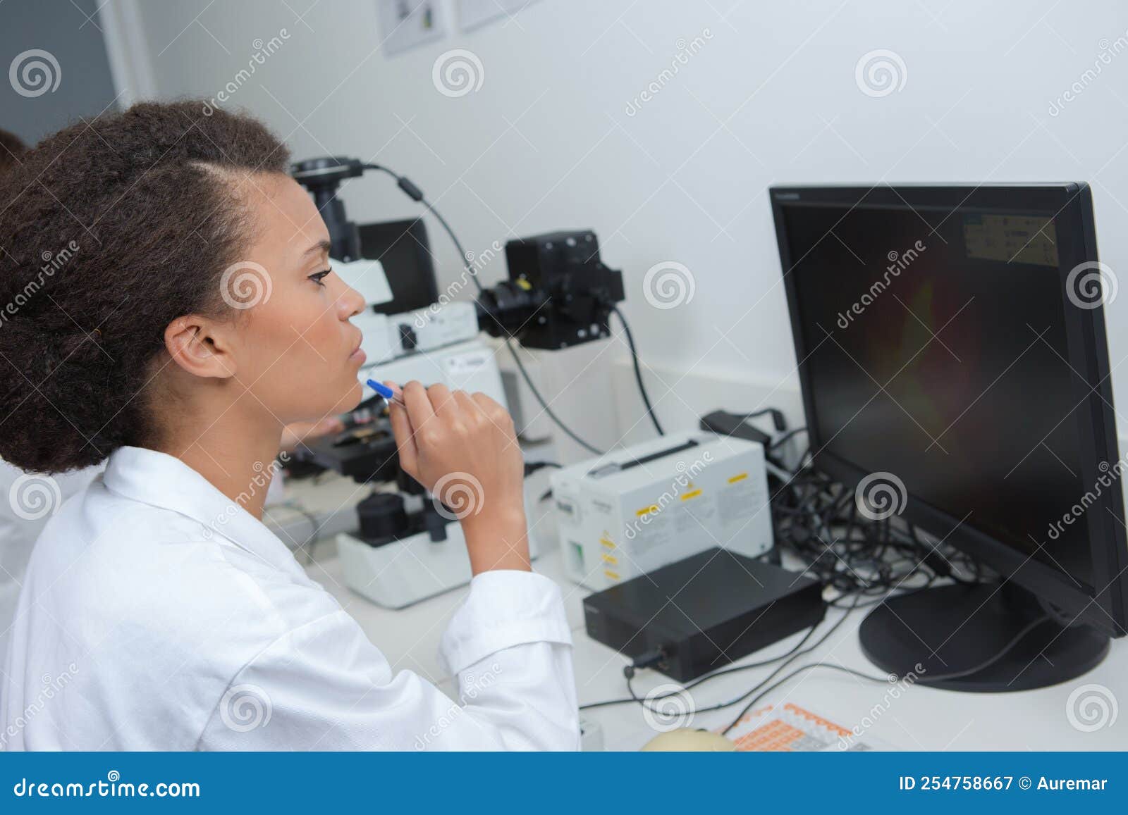 Female Scientist Looking at Computer Screen Stock Image - Image of ...