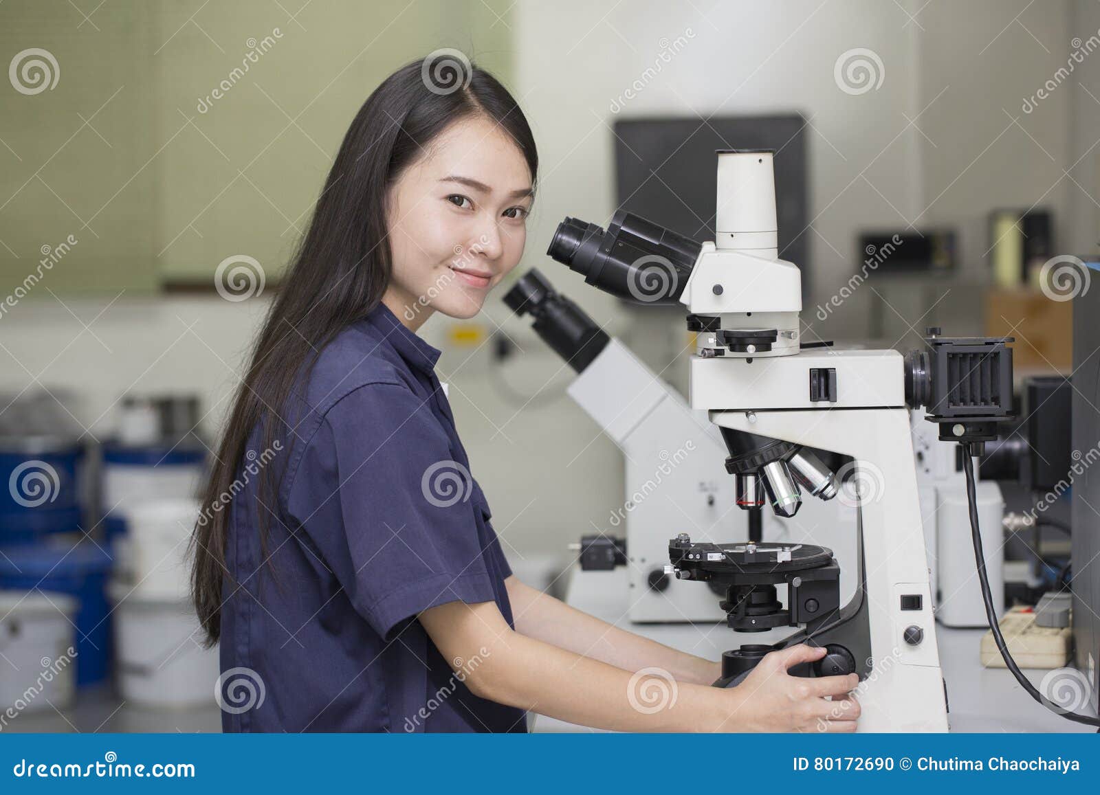 Female Scientist Looking in Microscope in Laboratory Microscope Stock ...