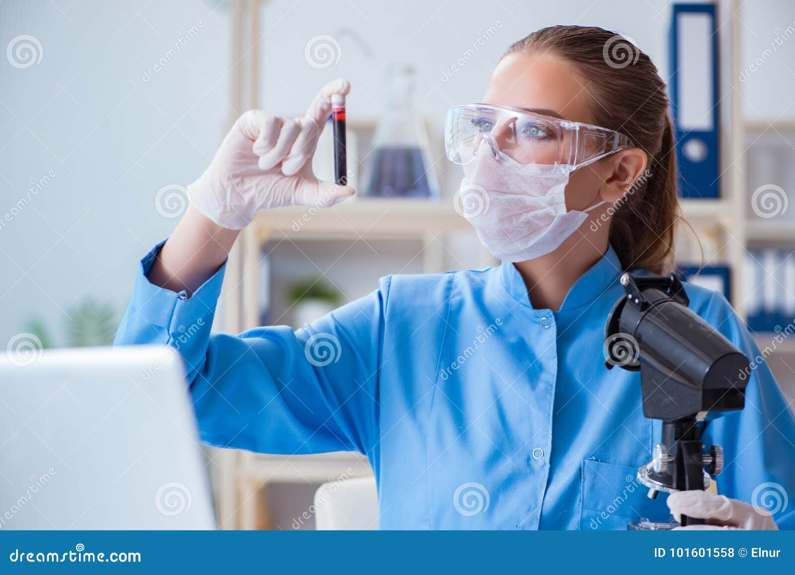 Female Scientist Researcher Conducting an Experiment in a Labora Stock ...