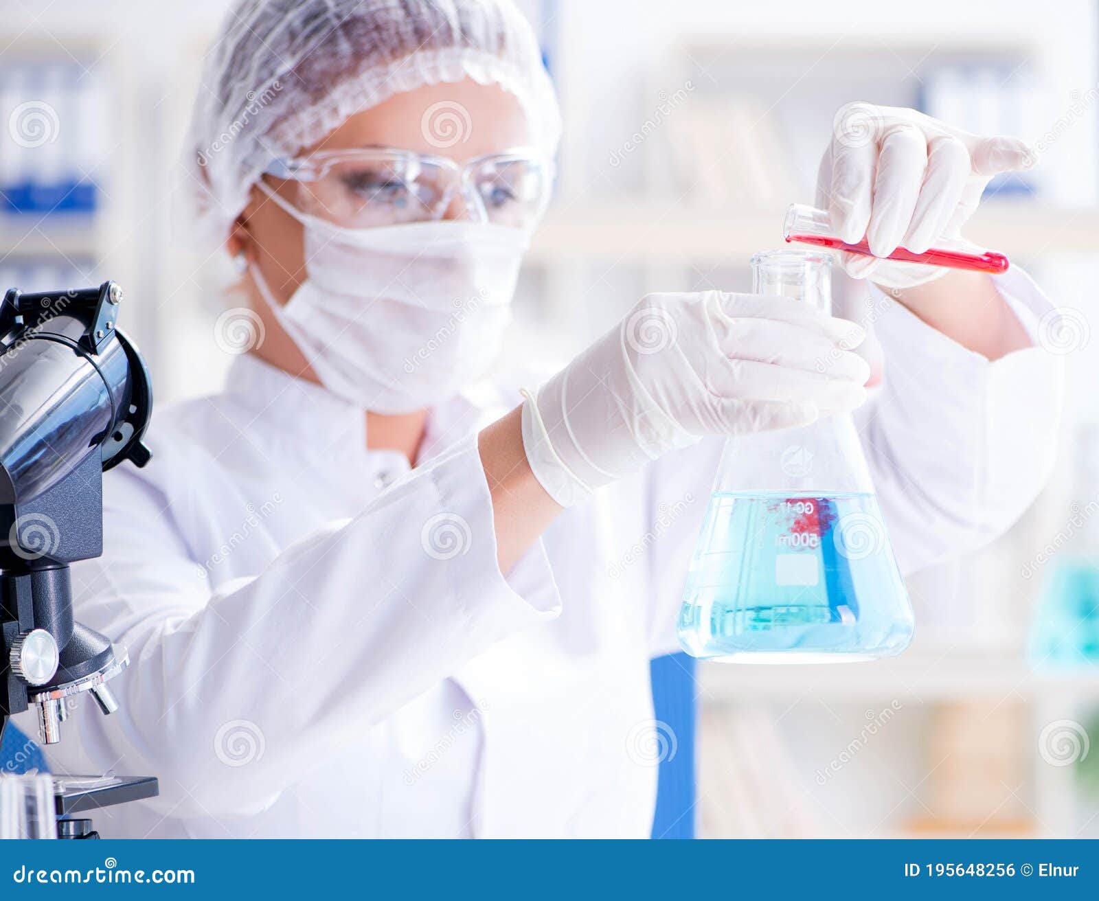 Female Scientist Researcher Conducting an Experiment in a Labora Stock ...