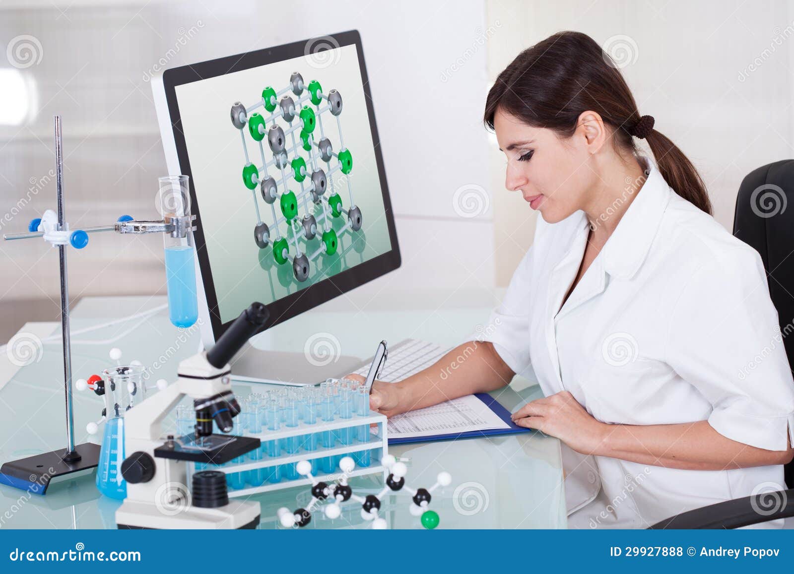 Female Scientist Writing on Notepad Stock Photo - Image of person ...