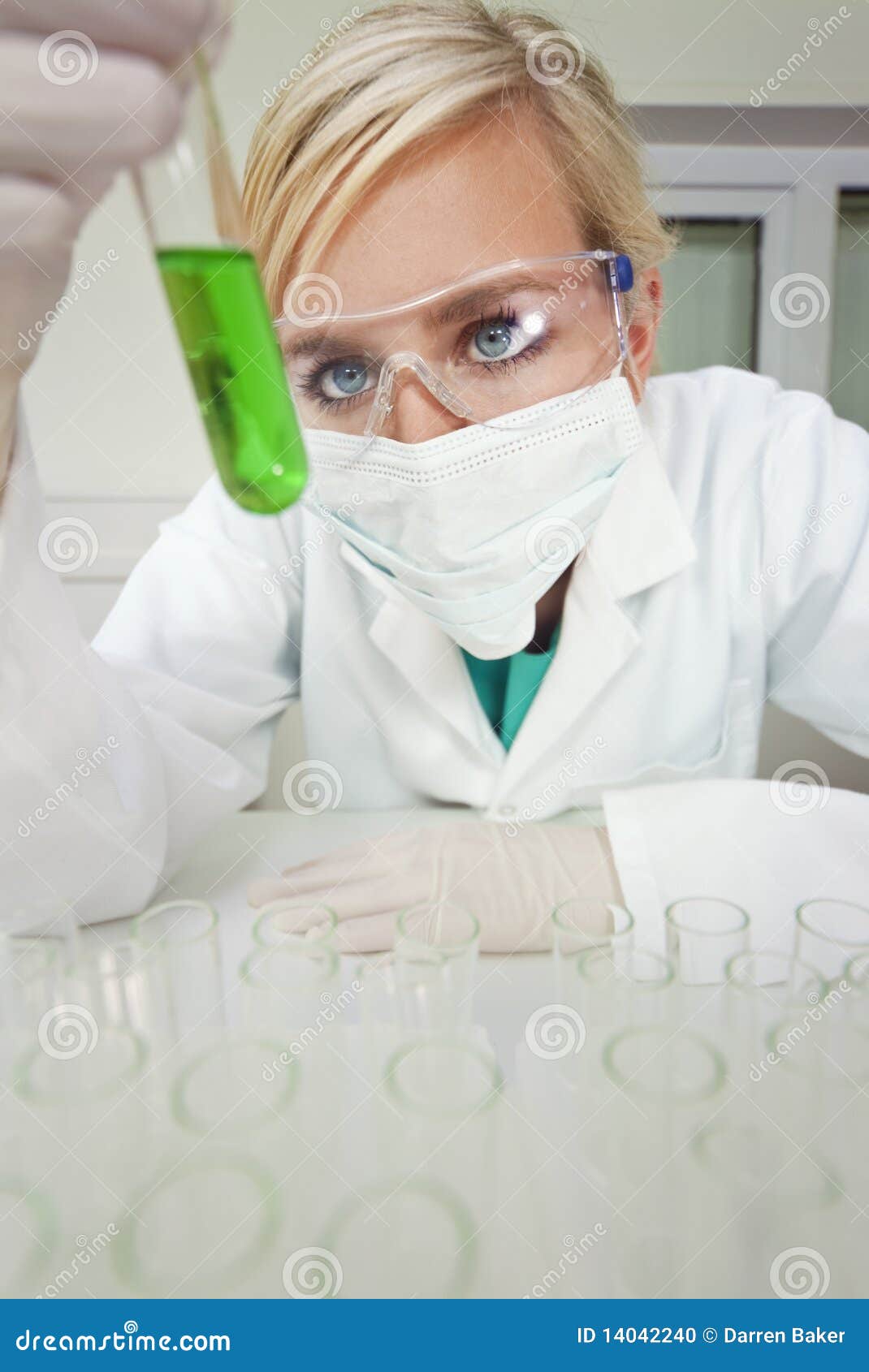 Female Scientist with Test Tube of Green Liquid Stock Photo - Image of ...