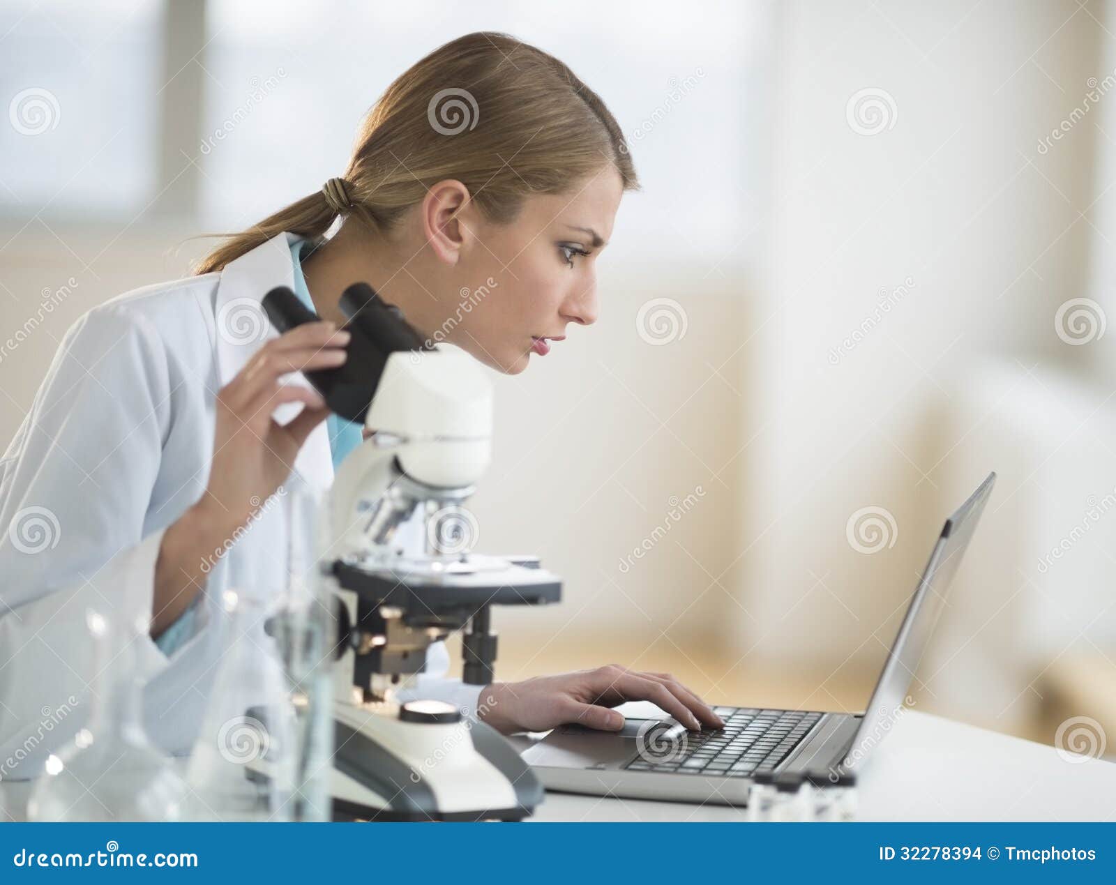 Female Scientist Using Laptop at Desk in Laboratory Stock Photo - Image ...