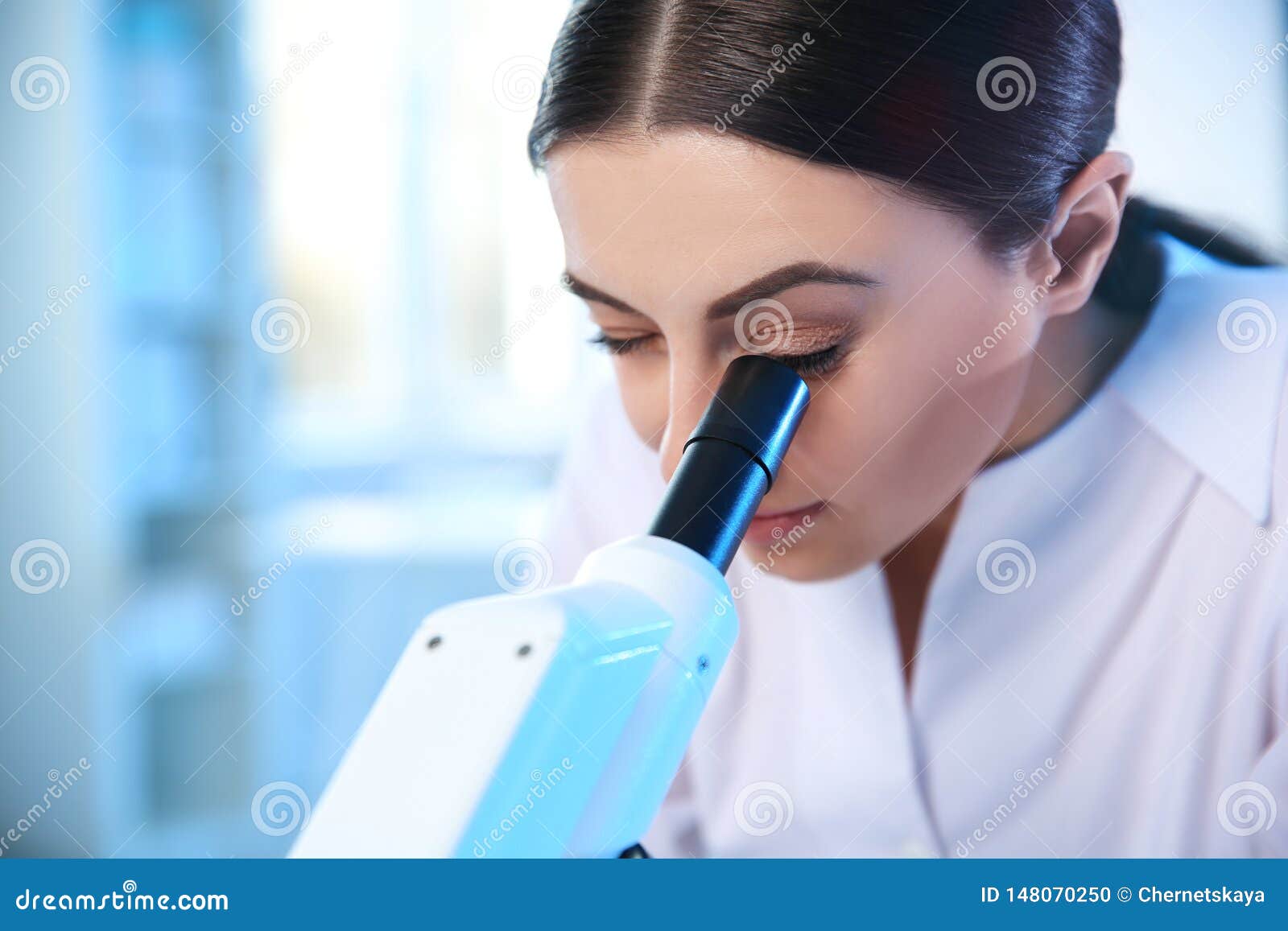 Female Scientist Using Microscope in Chemistry Laboratory Stock Photo ...