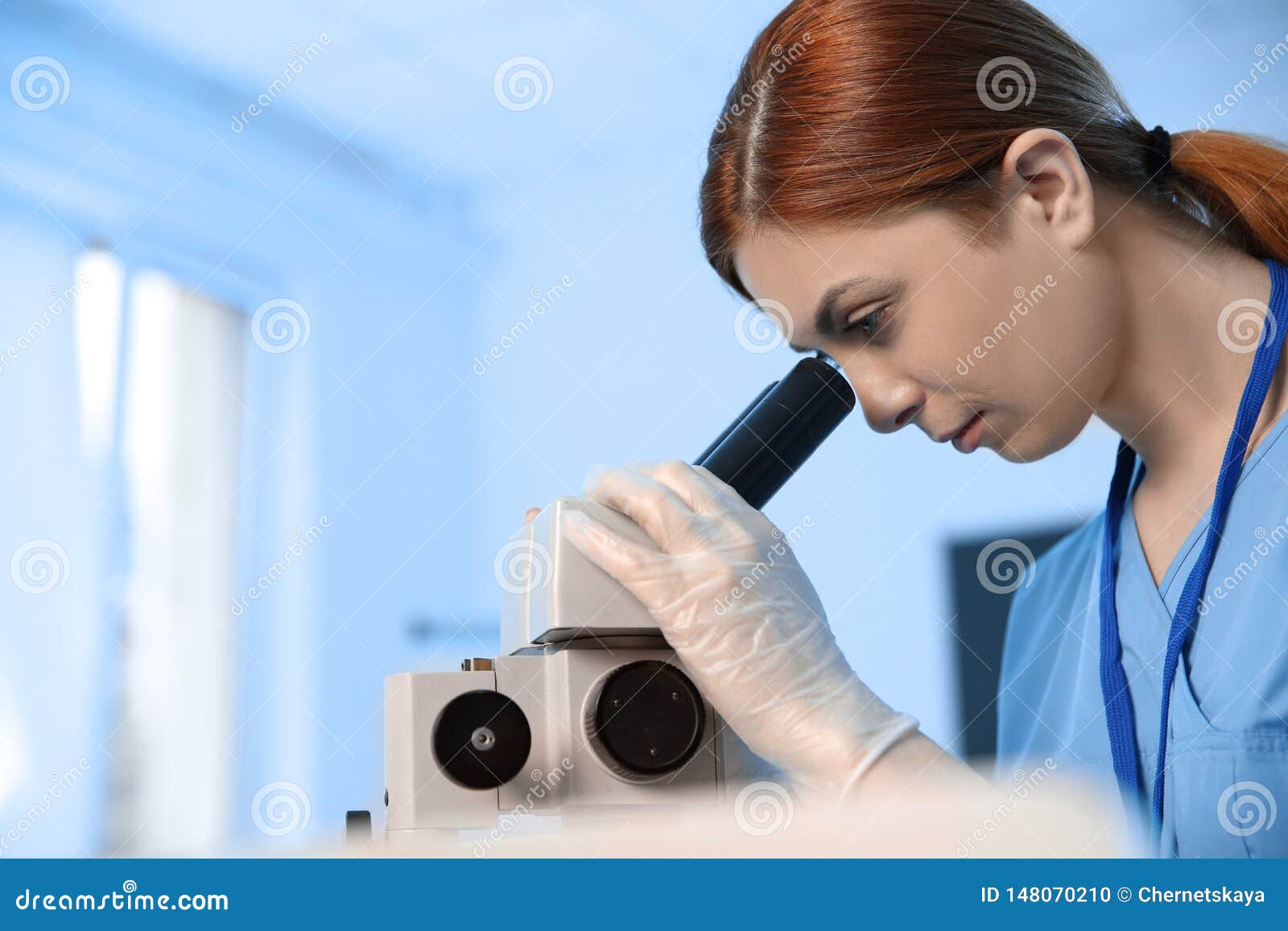Female Scientist Using Microscope in Chemistry Laboratory Stock Photo ...
