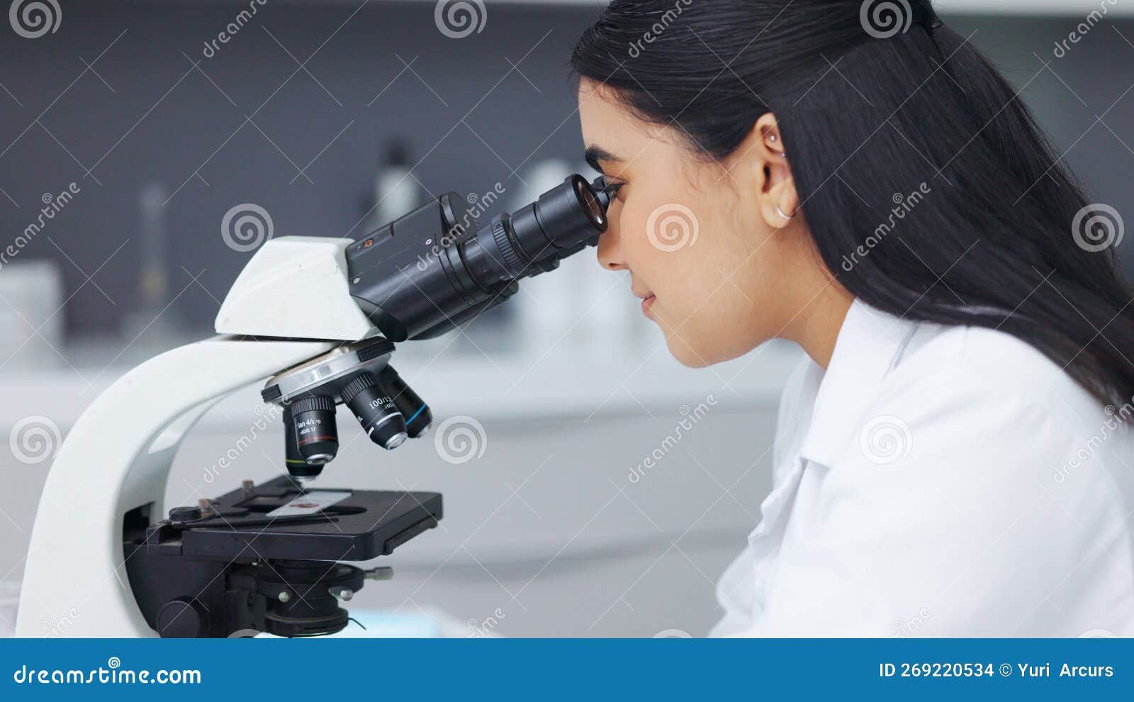 Female Scientist Using a Microscope in a Research Lab. Young Biologist ...