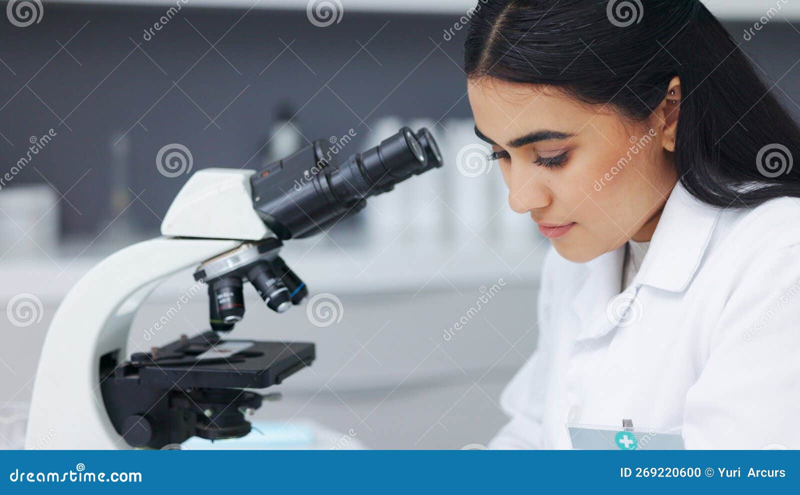 Female Scientist Using a Microscope in a Research Lab. Young Biologist ...