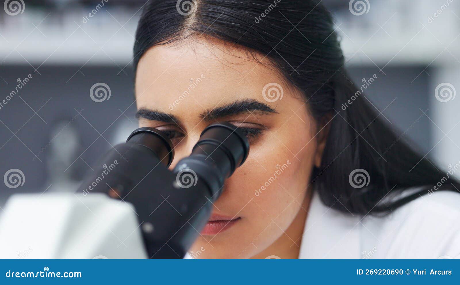 Female Scientist Using a Microscope in a Research Lab. Young Biologist ...