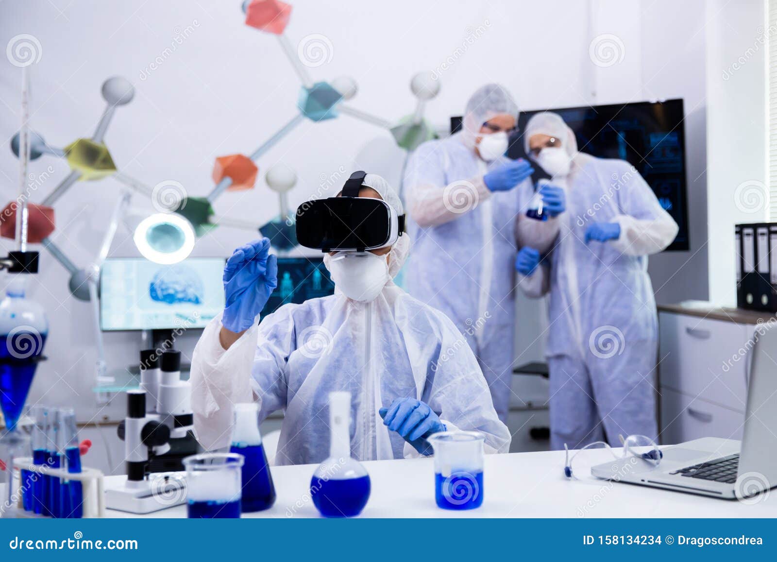 Female Scientist Using Virtual Reality Goggles Simualtion for Chemical ... Female Scientist Using Virtual Reality Goggles Simualtion for Chemical ...