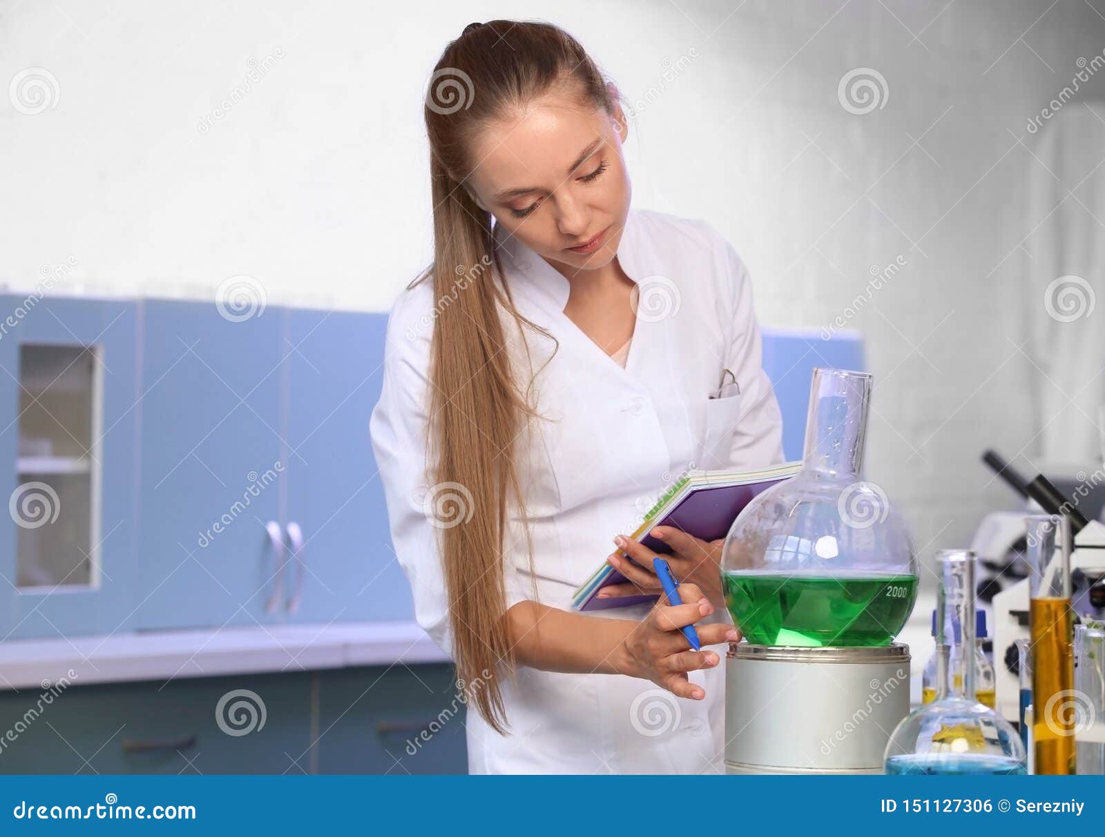 Female Scientist Working in Laboratory Stock Photo - Image of robe ...