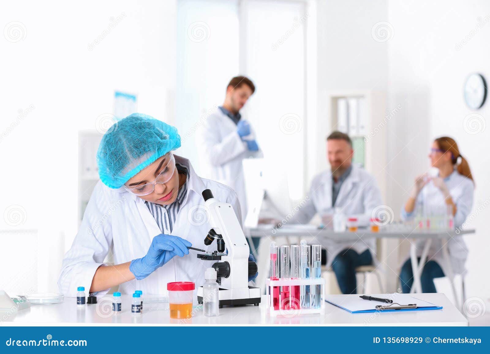 Female Scientist Working at Table in Laboratory Stock Image - Image of ...