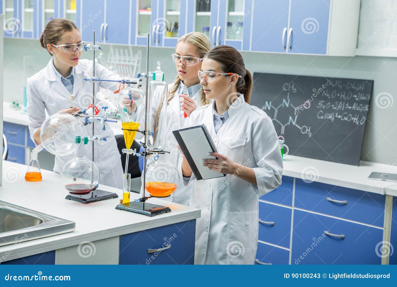 Female scientists in lab stock image. Image of examining - 90100243