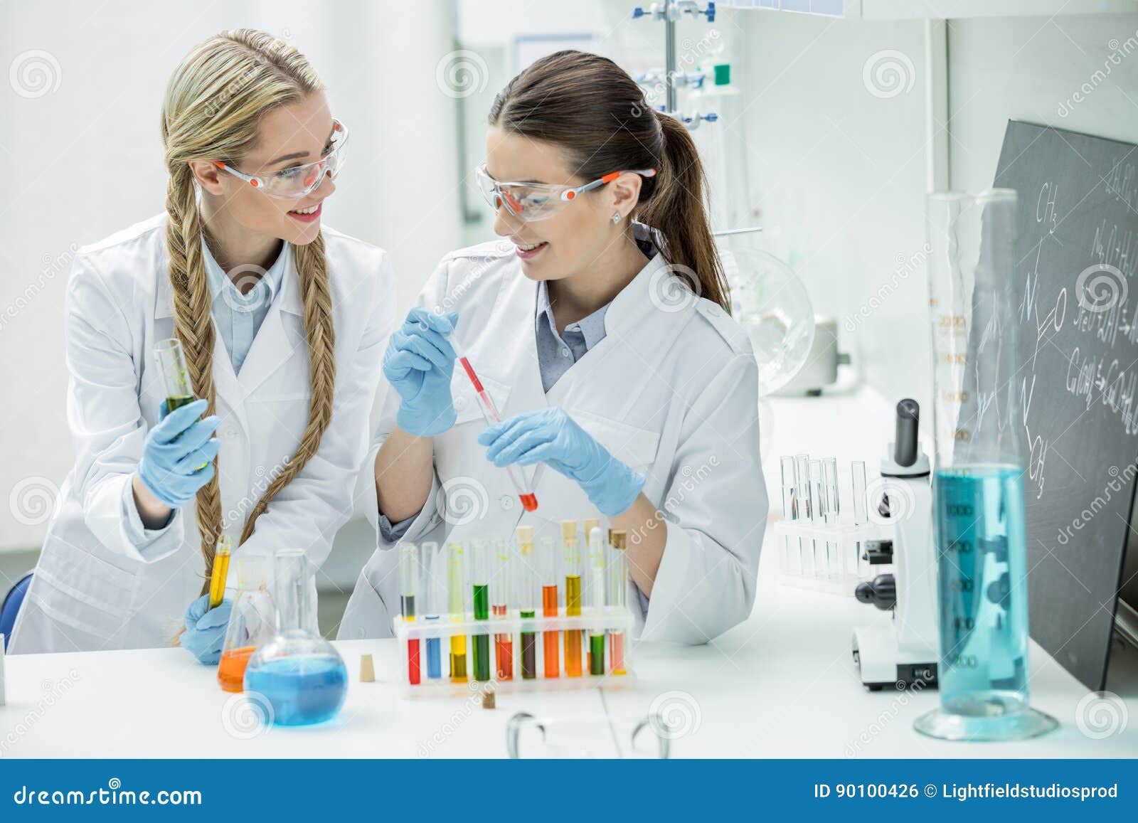 Female scientists in lab stock photo. Image of scientists - 90100426
