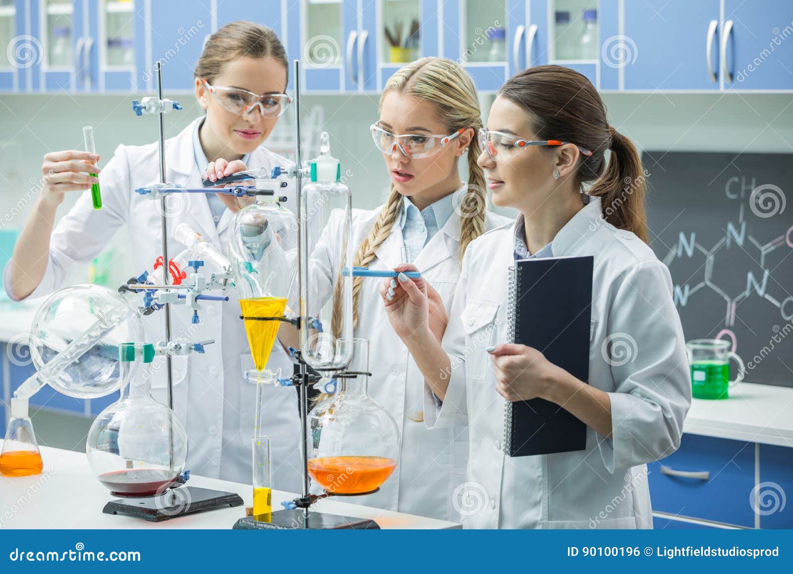 Female scientists in lab stock photo. Image of teamwork - 90100196