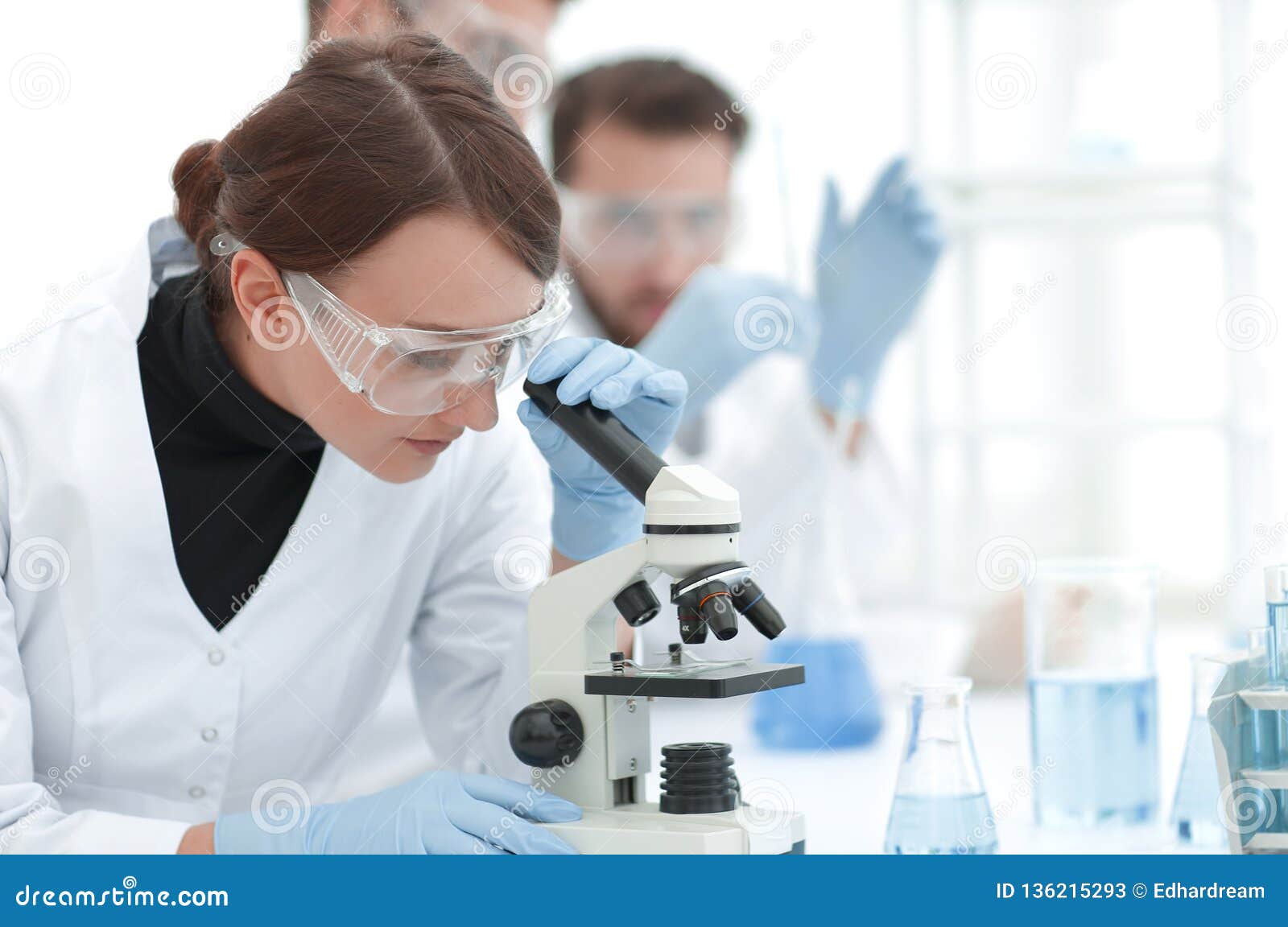 Female Scientists Looking into a Microscope Stock Image - Image of ...