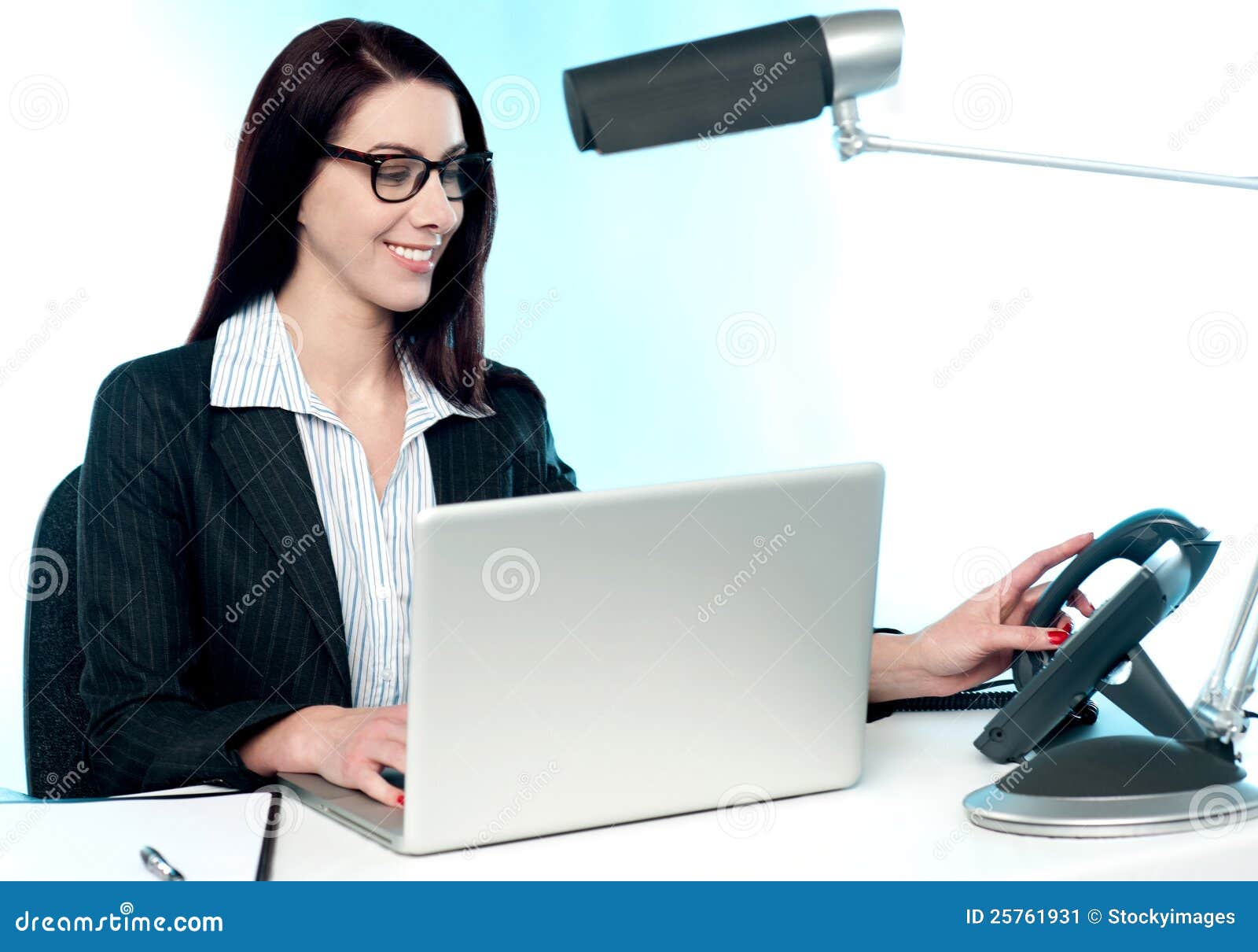 Female Secretary Answering Phone Call Stock Image - Image of office ...