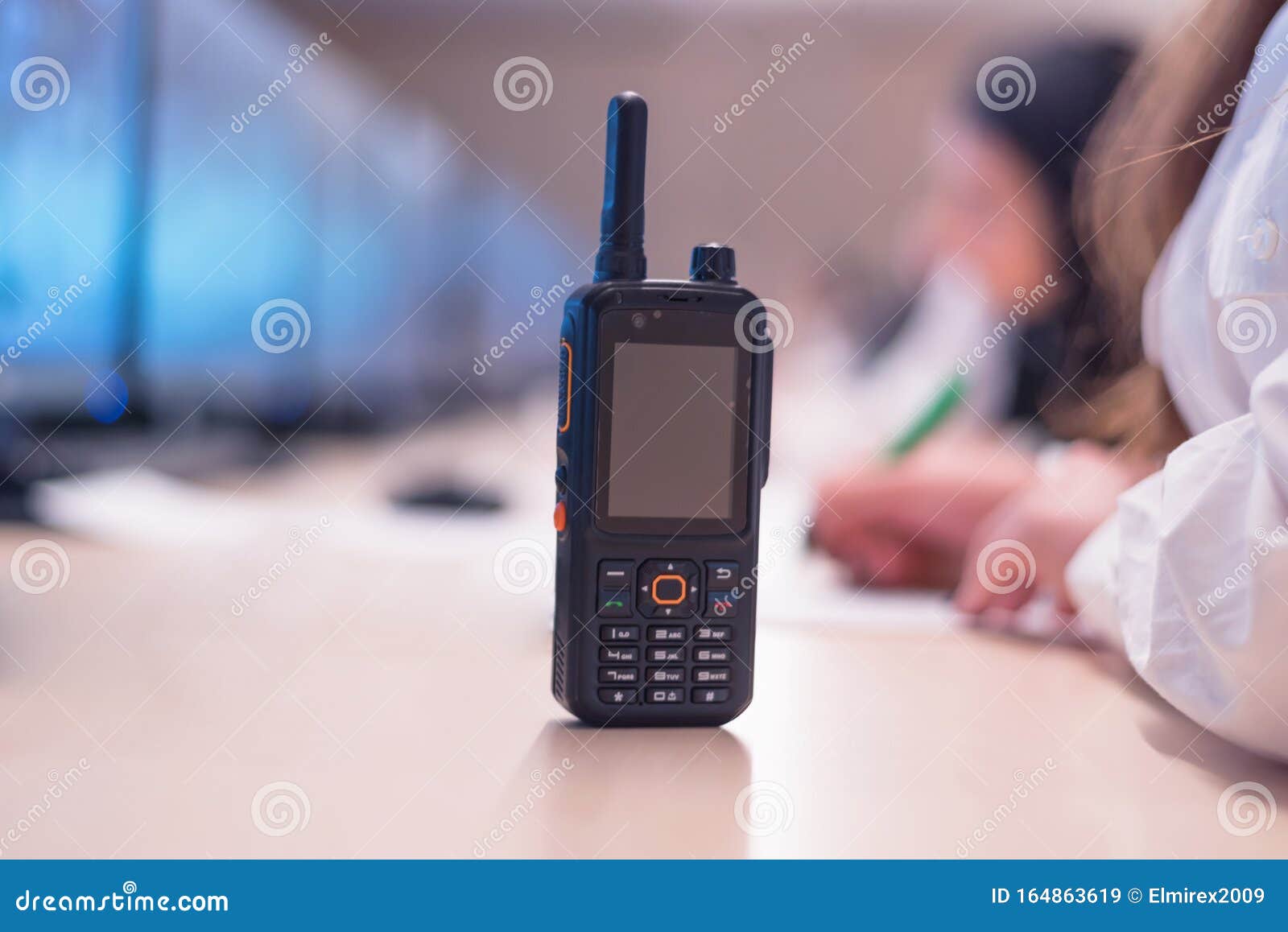 Female Security Guard Operator Talking on the Phone, Calling in the ...
