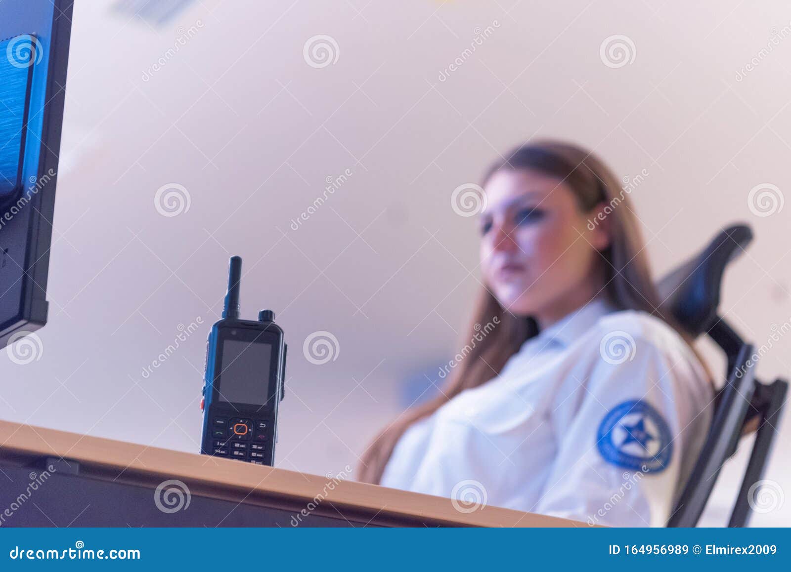 Female Security Guard Operator Talking on the Phone, Calling in the ...
