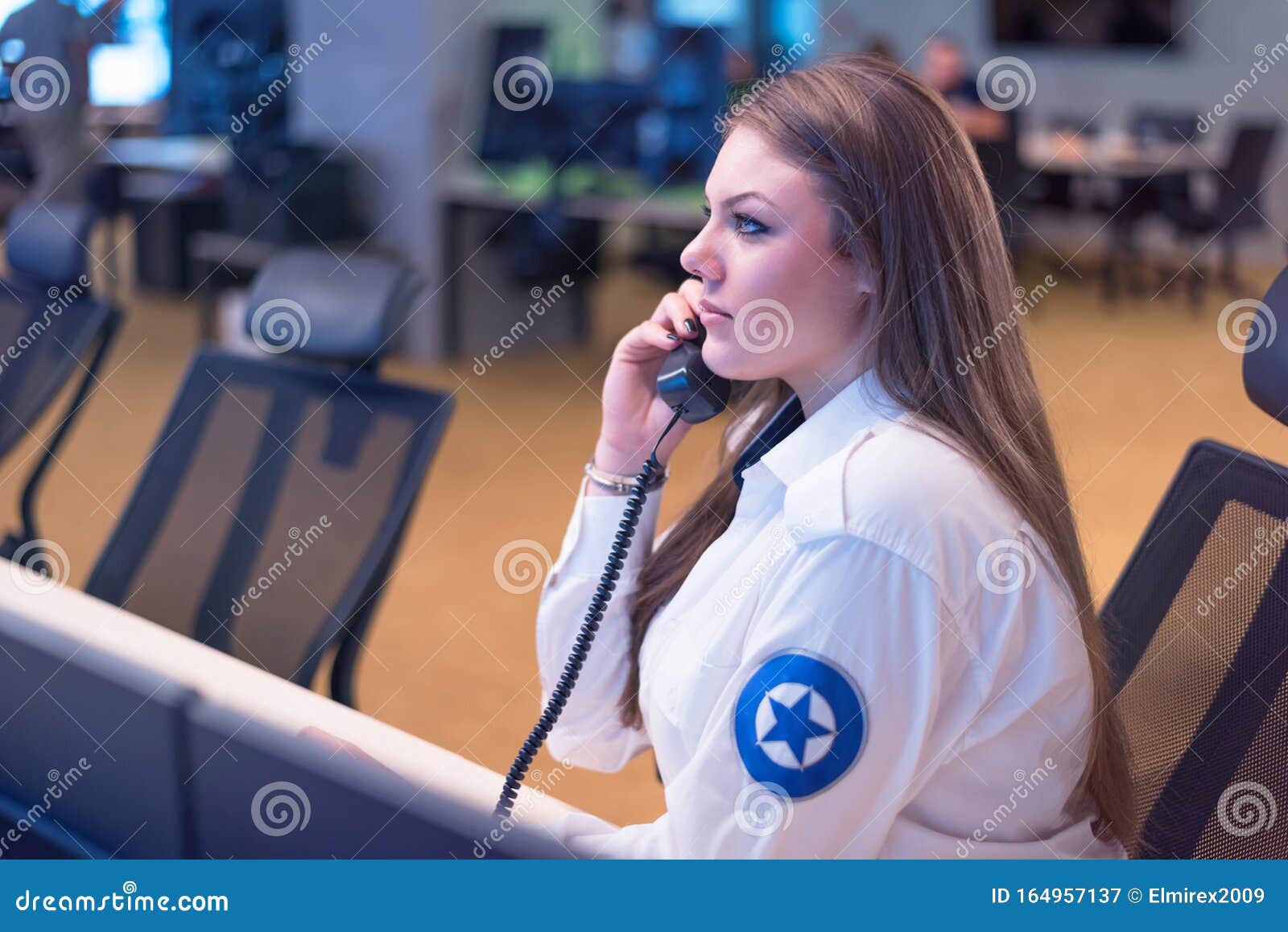 Female Security Guard Operator Talking on the Phone, Calling in the ...