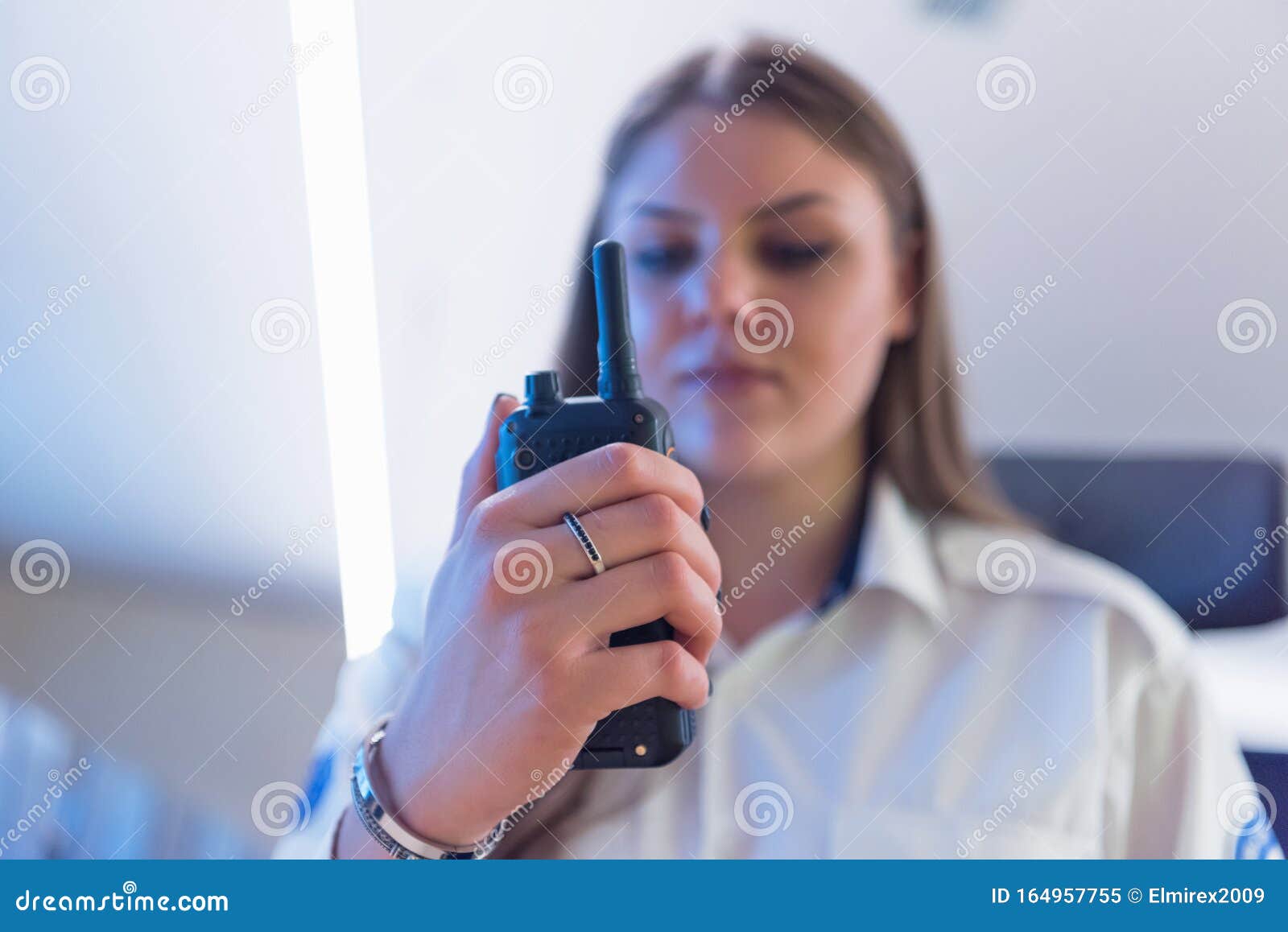 Female Security Guard Operator Talking on the Phone, Calling in the ...