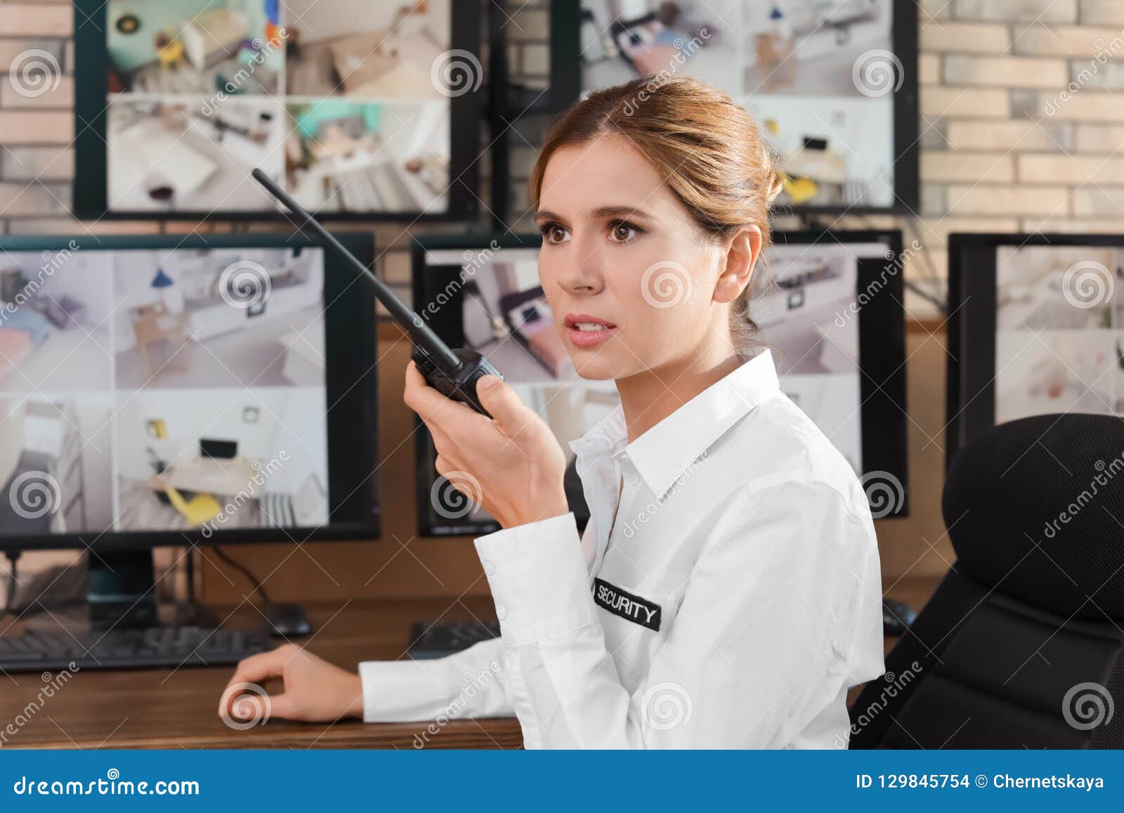 Female Security Guard with Portable Transmitter at Workplace. Stock ...