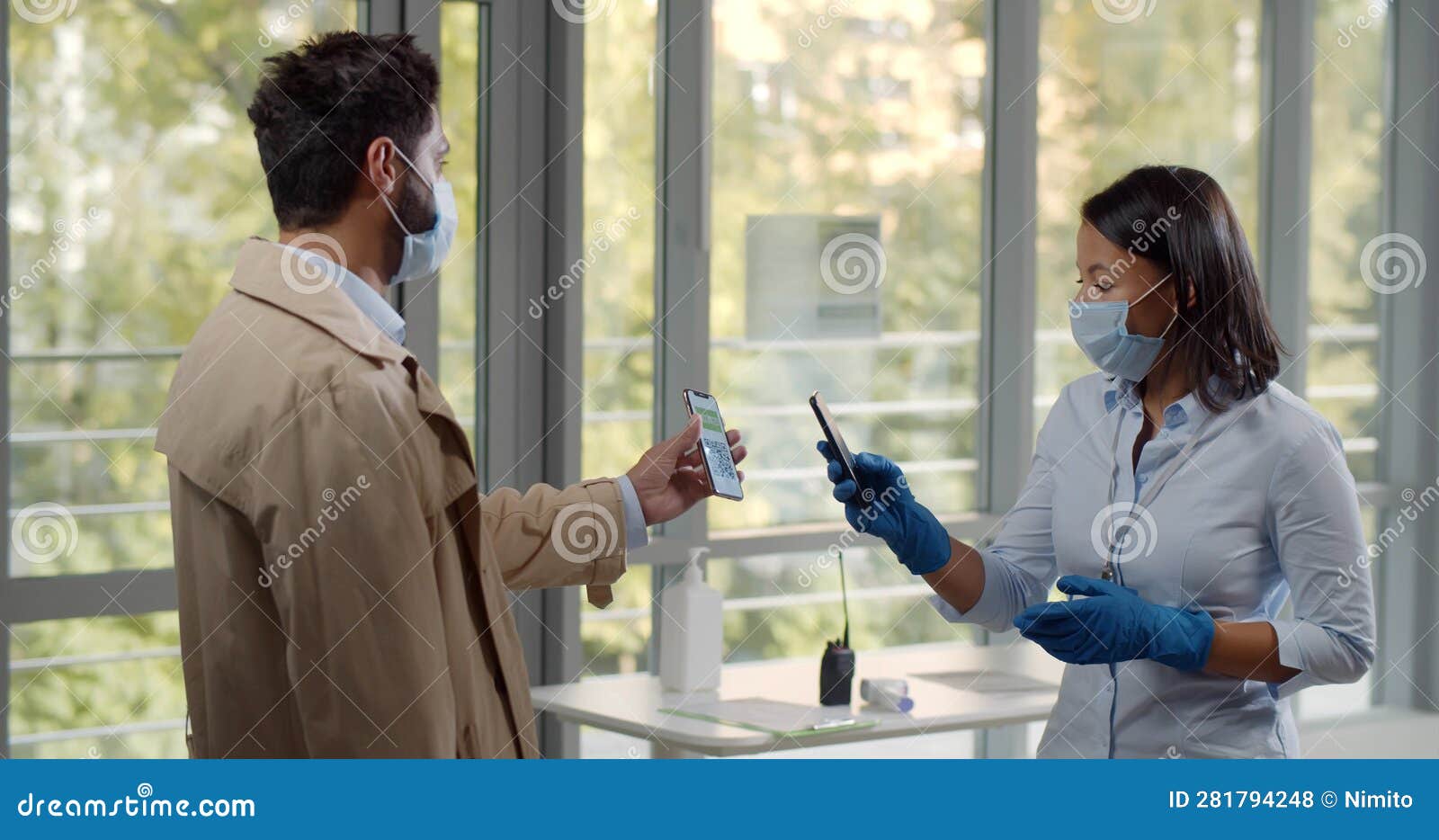 Female Security Guard in Safety Mask and Gloves Scan Vaccination Qr ...