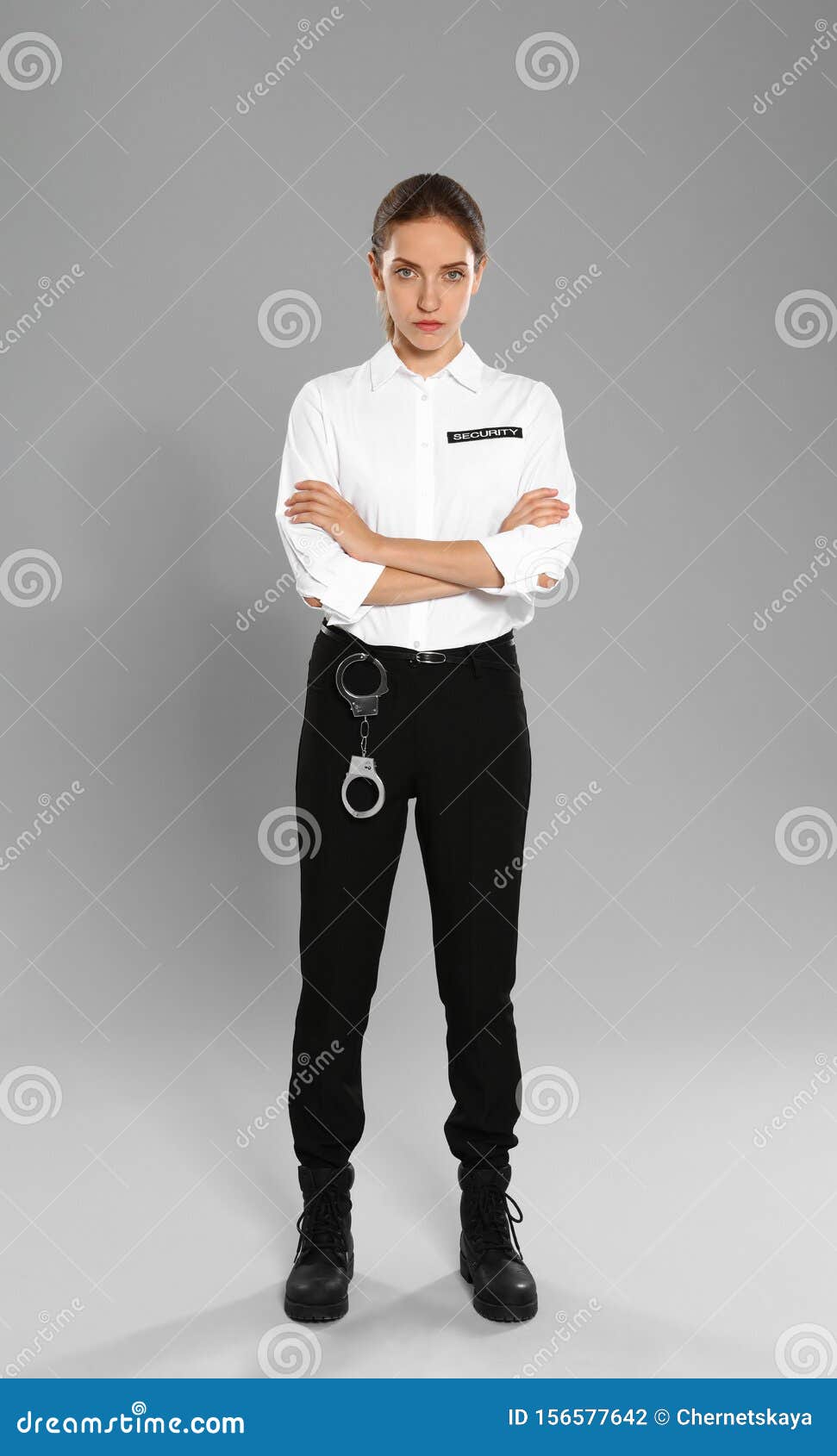 Female Security Guard in Uniform on Grey Stock Photo - Image of ...