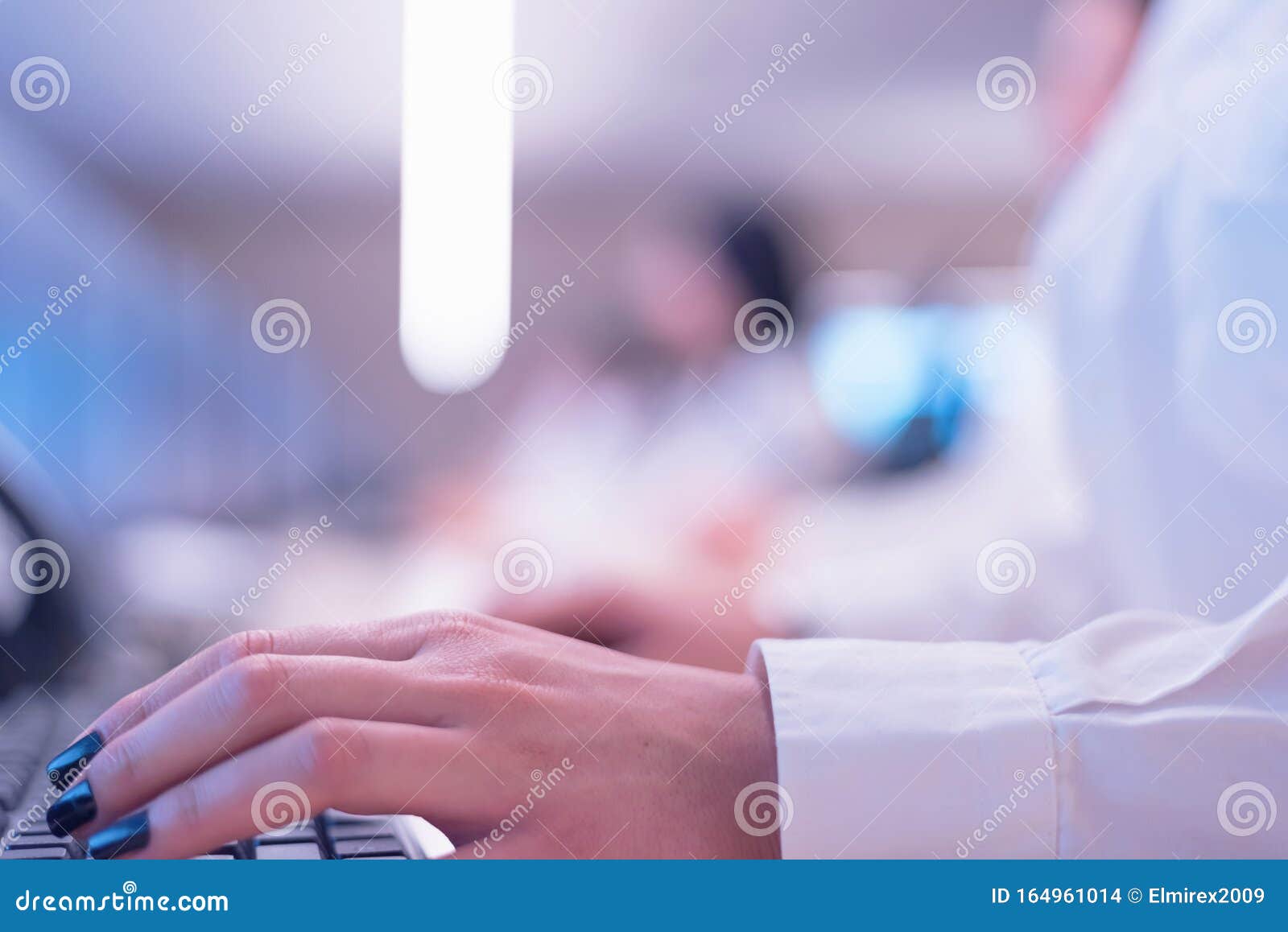 Female Security Guard Working on Computers while Sitting in the Main ...