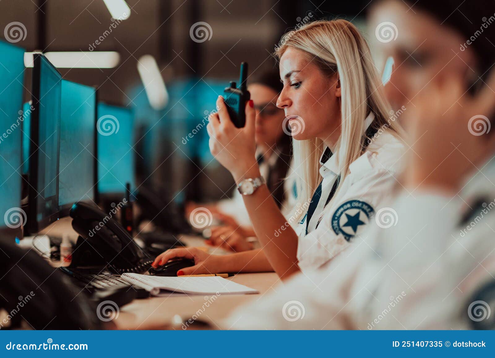 Female Security Operator Holding Portable Radio in Hand while Working ...