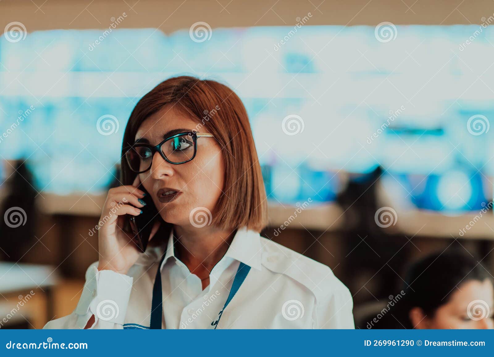 Female Security Operator Working in a Data System Control Room Offices ...