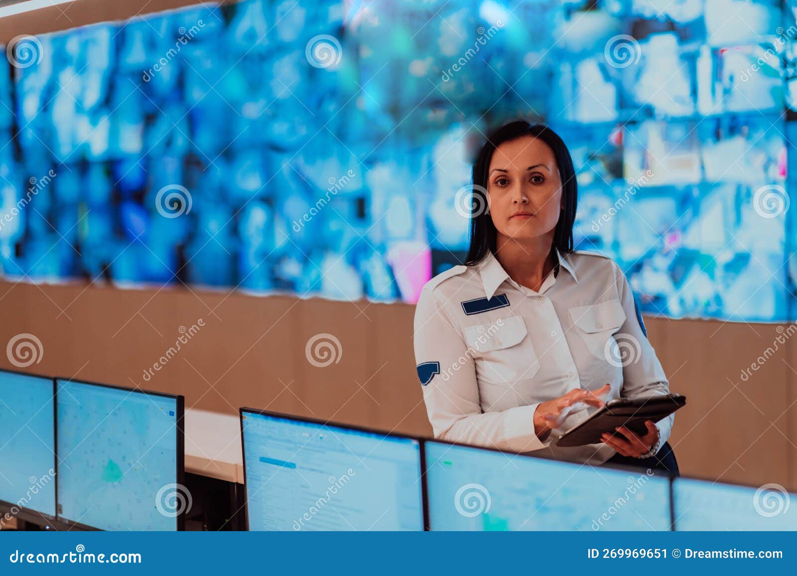 Female Security Operator Working in a Data System Control Room Offices ...