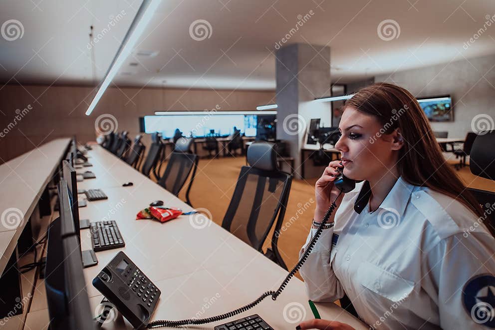Female Security Operator Working in a Data System Control Room Offices ...