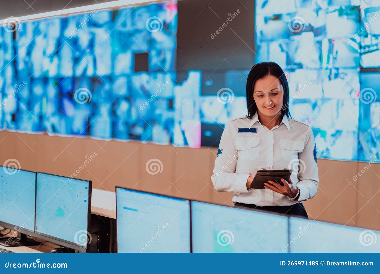 Female Security Operator Working in a Data System Control Room Offices ...