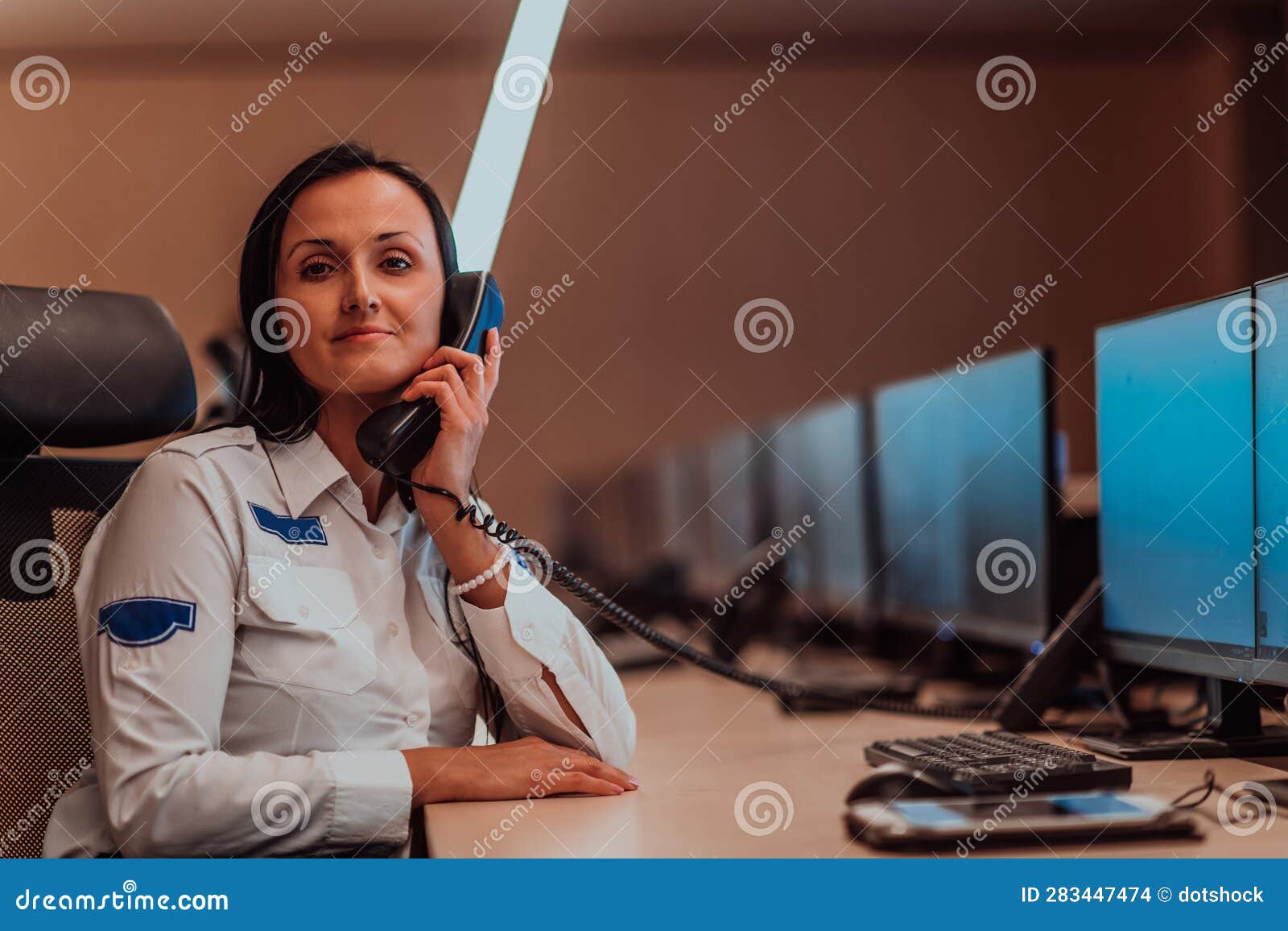 Female Security Operator Working in a Data System Control Room Offices ...