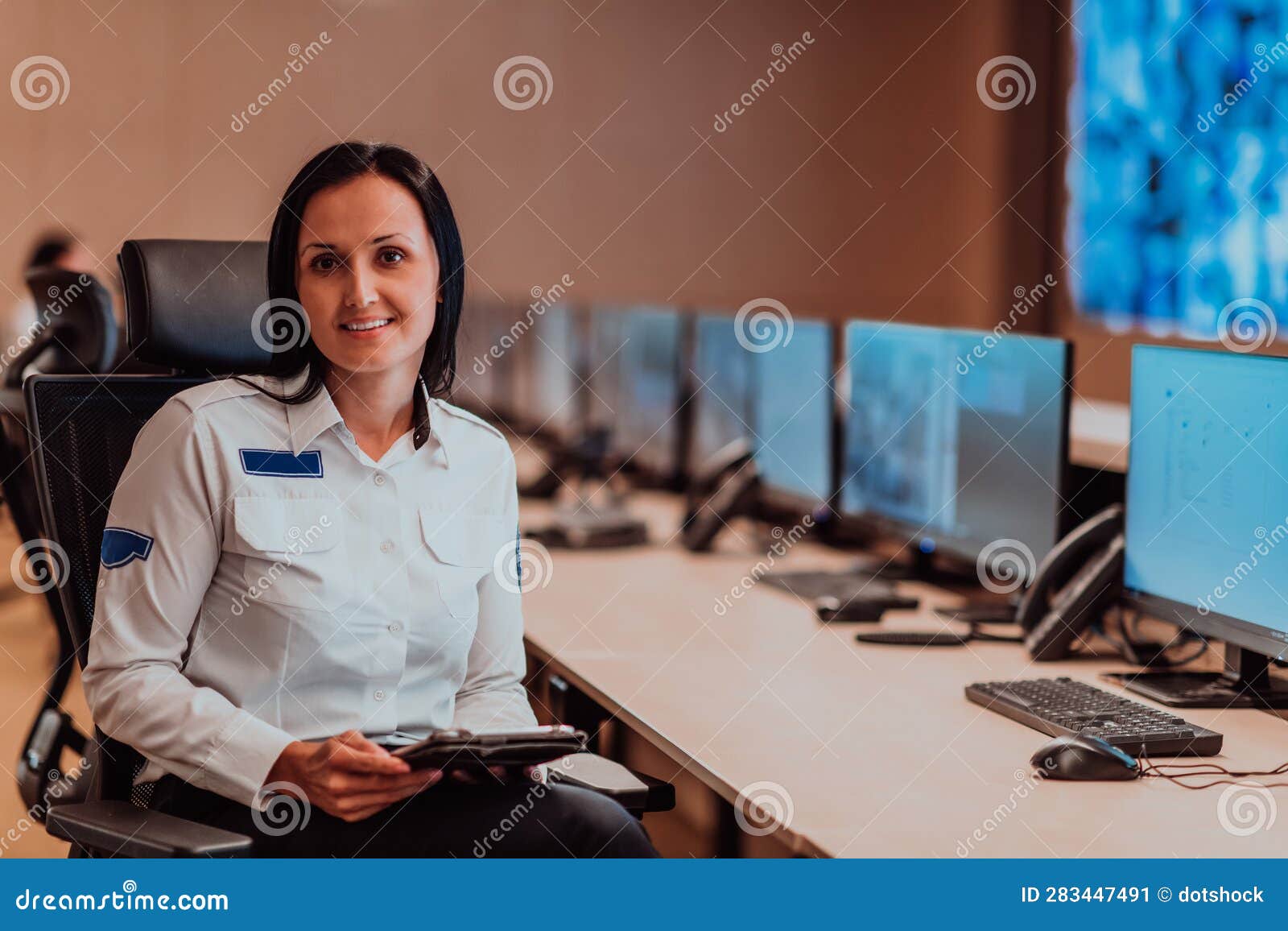 Female Security Operator Working in a Data System Control Room Offices ...