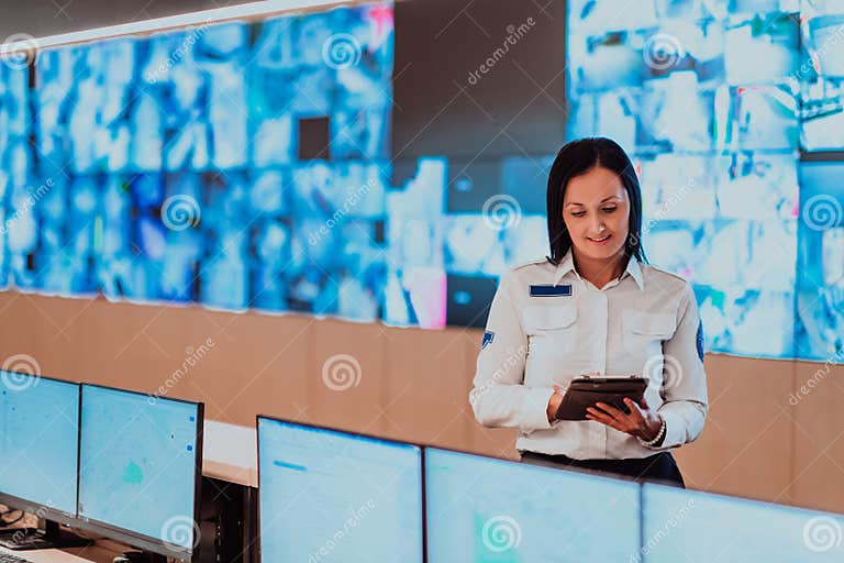 Female Security Operator Working in a Data System Control Room Offices ...