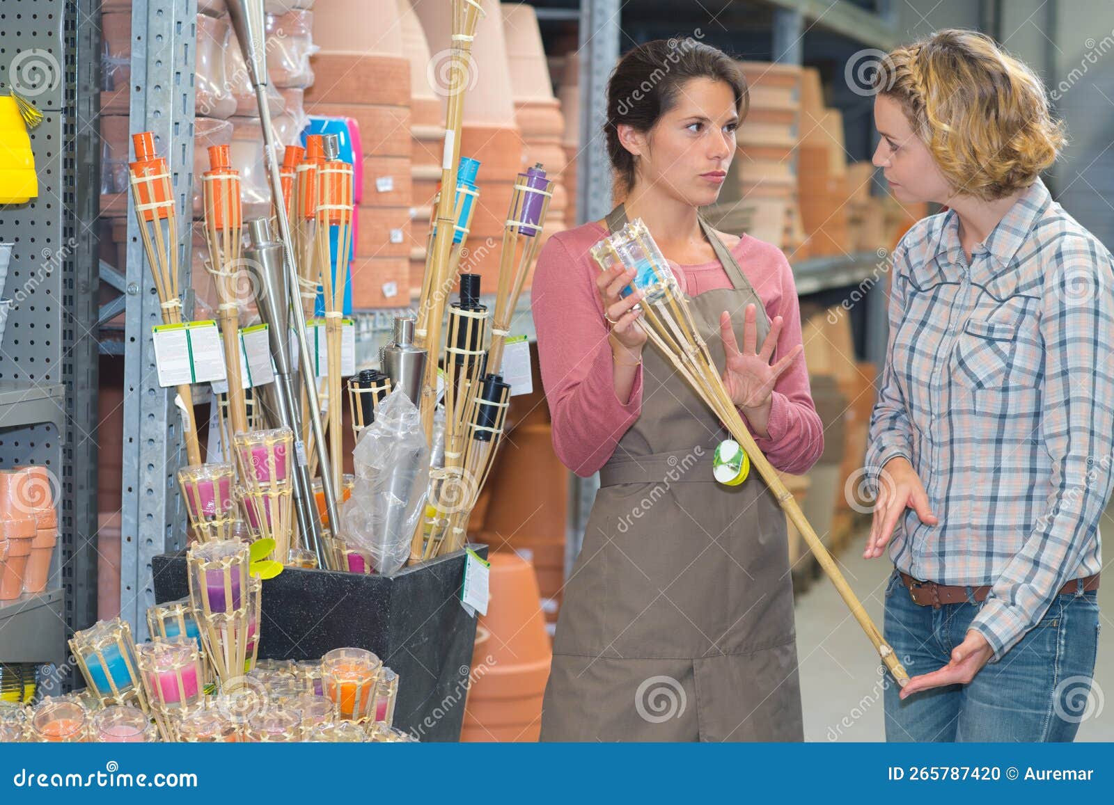 Female Seller Helping Pretty Client Stock Photo - Image of purchase ...