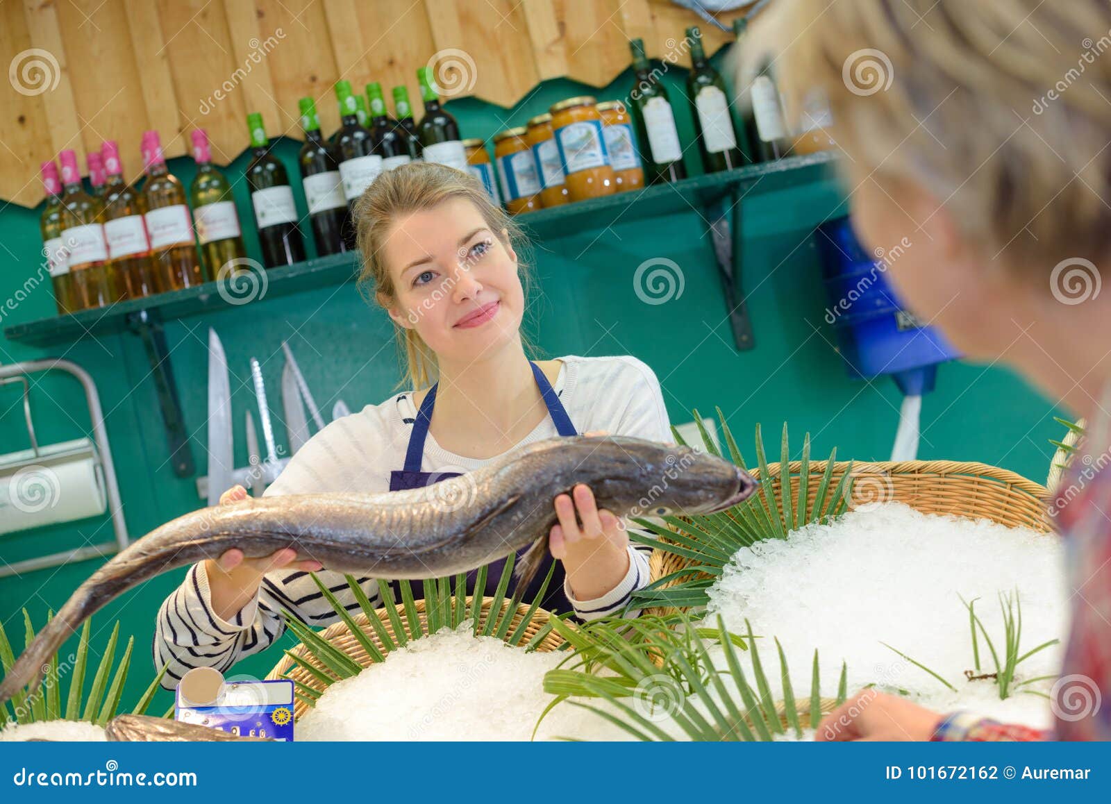 Female Seller Holding Fish in Front Client Stock Photo - Image of cute ...