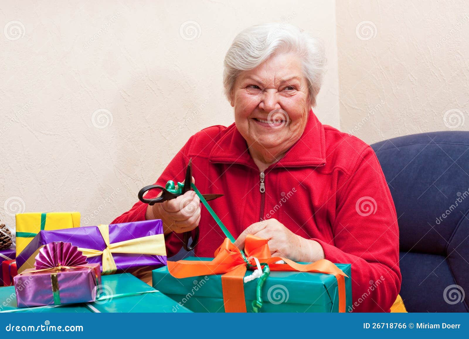 Female Senior Pack or Unpack an Gift Stock Photo - Image of home ...