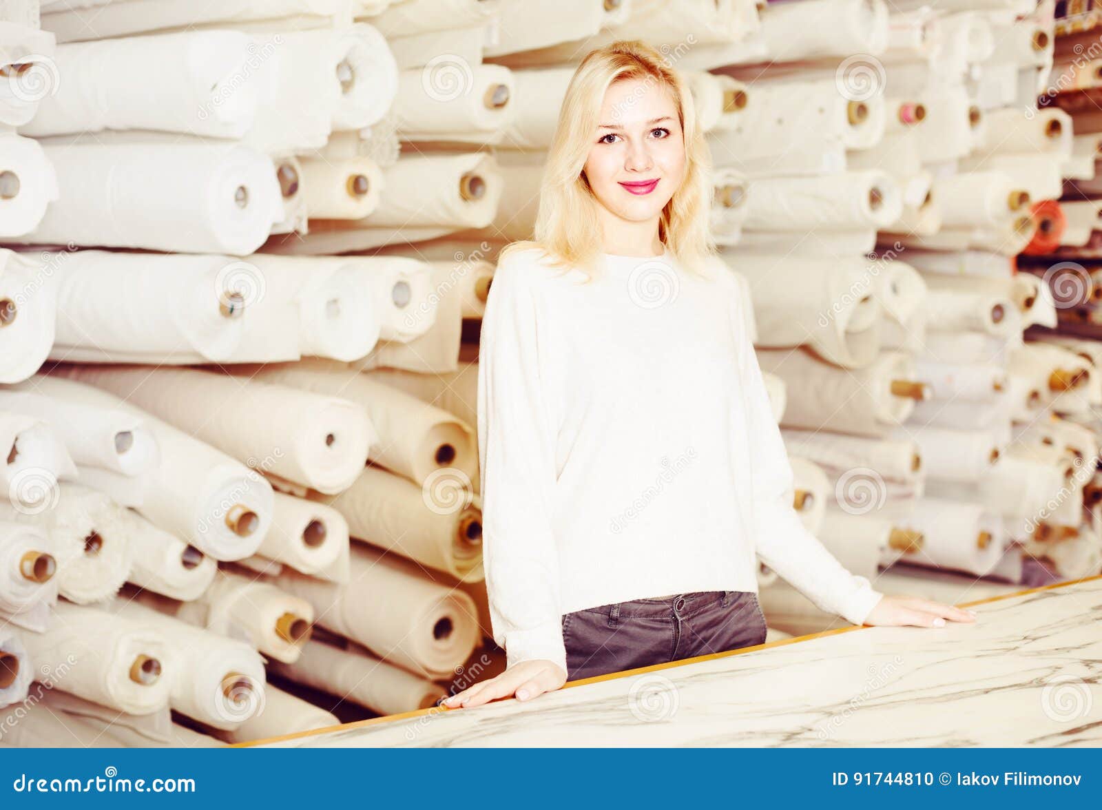 Female Shop Assistant Demonstrating Assortment Stock Photo - Image of ...