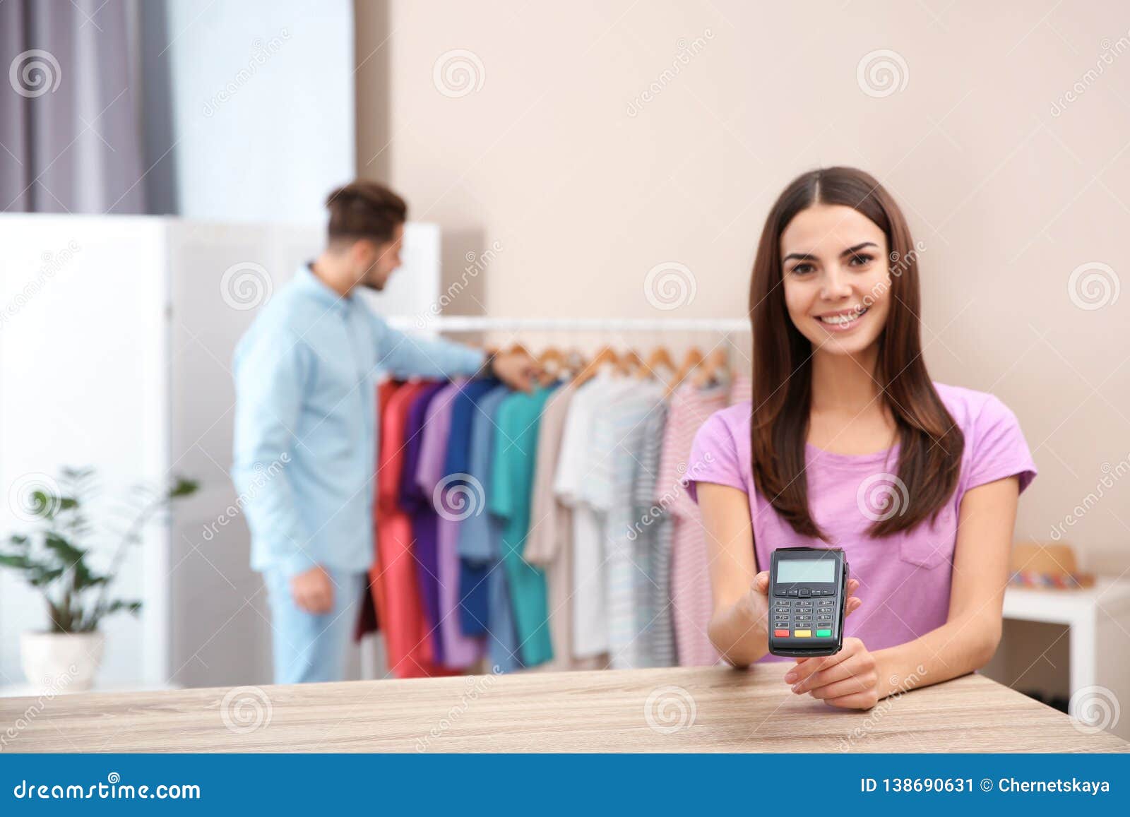 Female Shop Assistant with Payment Terminal at Counter Stock Image ...