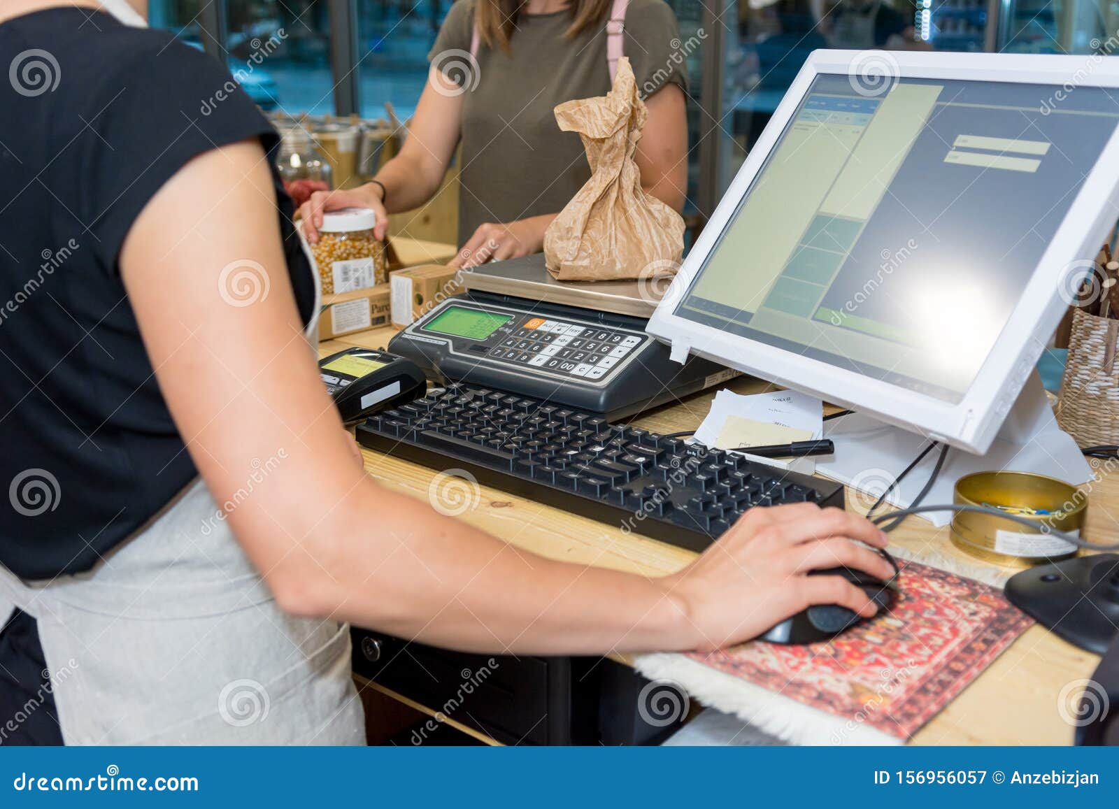 Female Shop Assistant Serving A Customer At A Desk Stock Image Image Of Candies Consumer