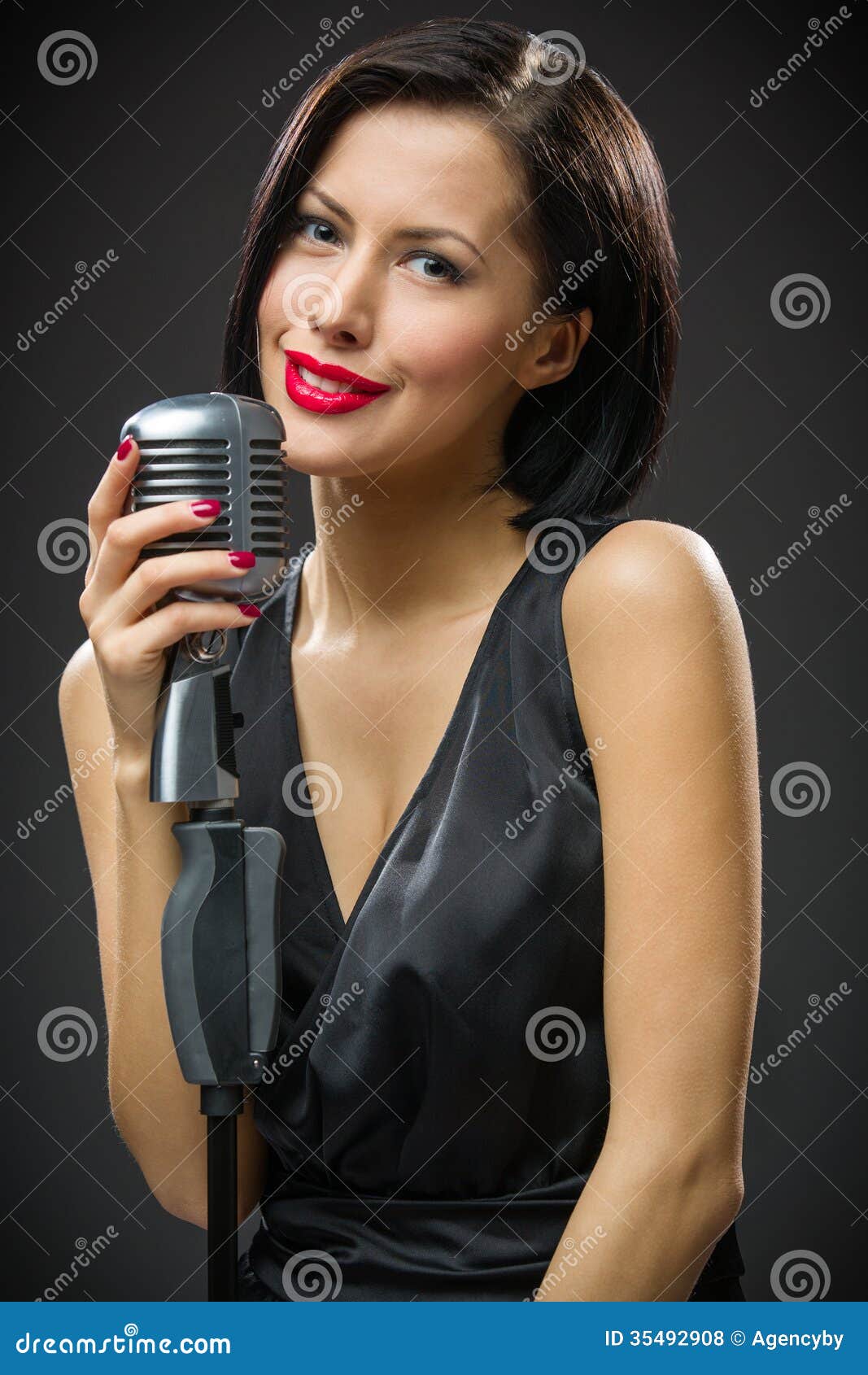 Female Singer Handing Microphone Stock Photo - Image of adult, color ...