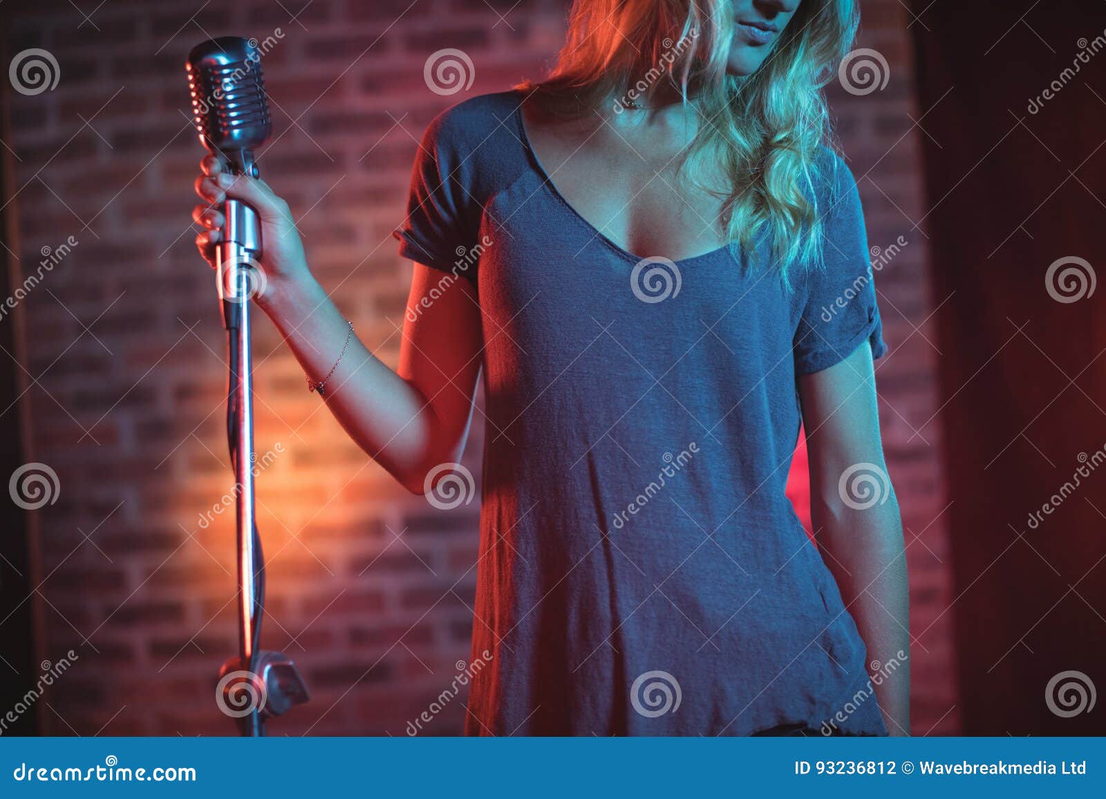 Female Singer with Microphone Standing in Nightclub Editorial ...