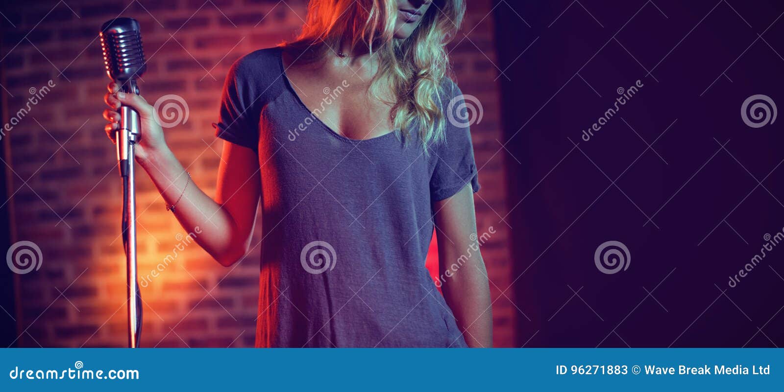 Female Singer with Microphone Standing in Nightclub Stock Image - Image ...
